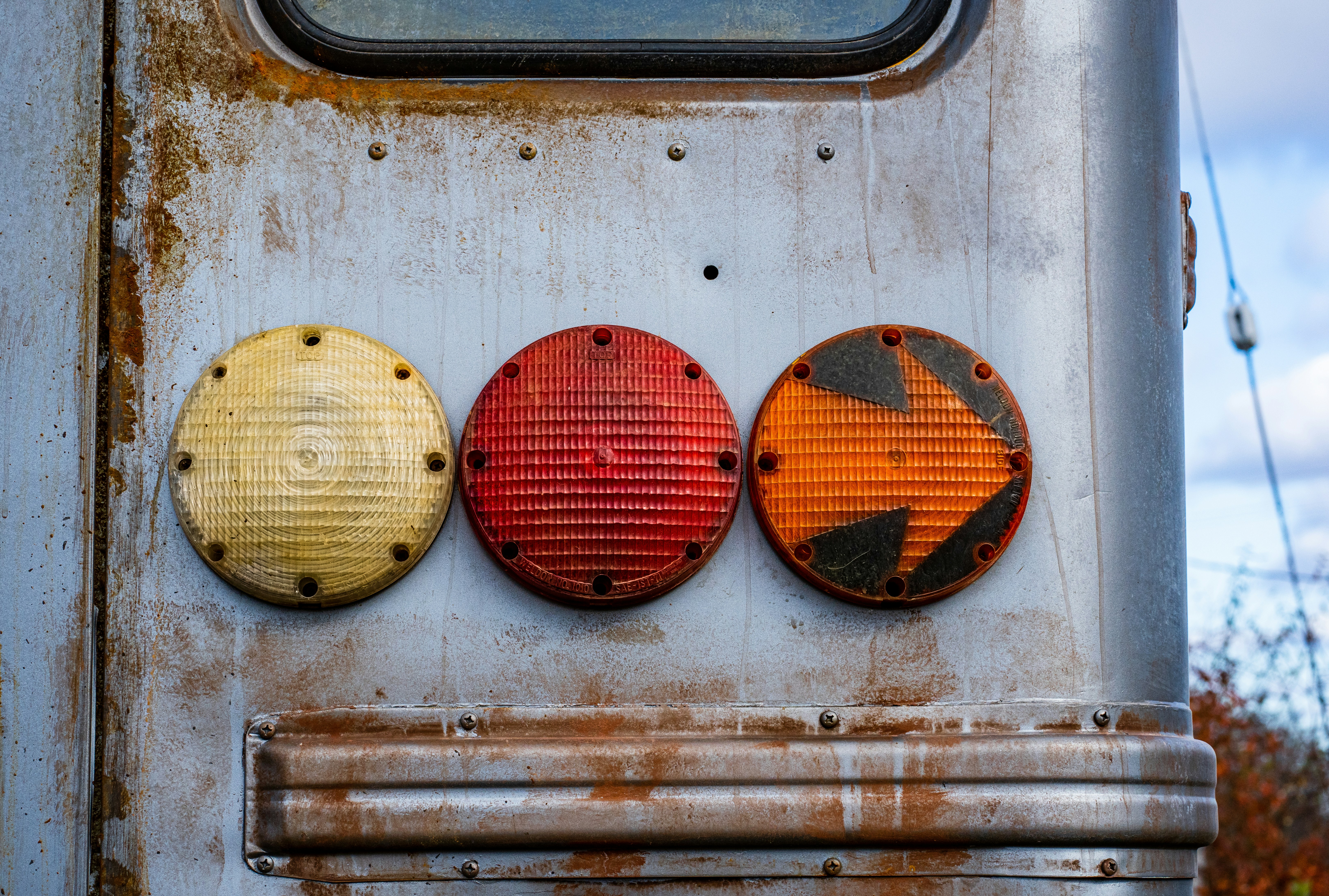 Three Weathered Signals: A Rusted Locomotive’s Silent Watch