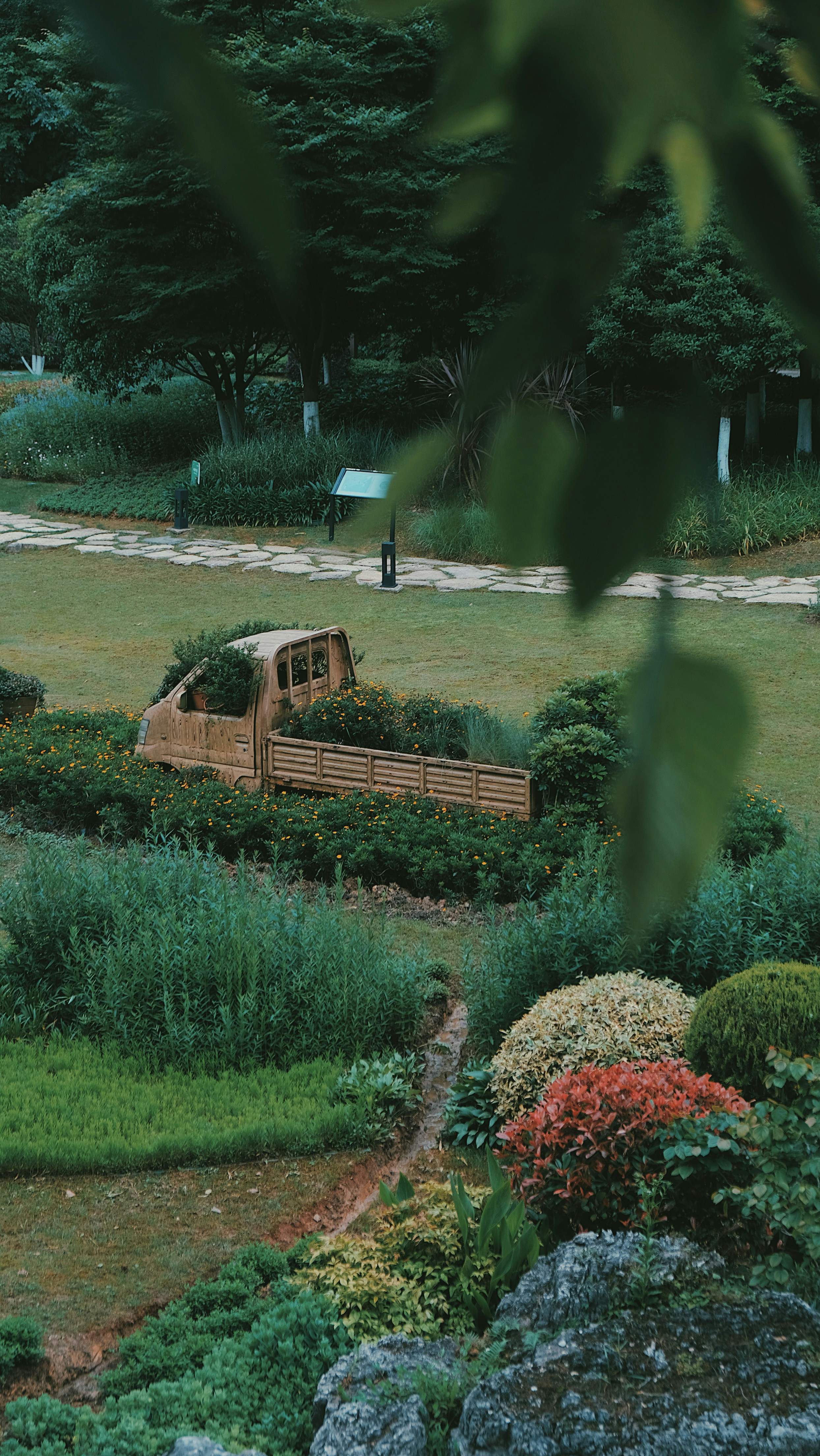 A Weathered Pickup Framed by a Garden of Quiet Geometry