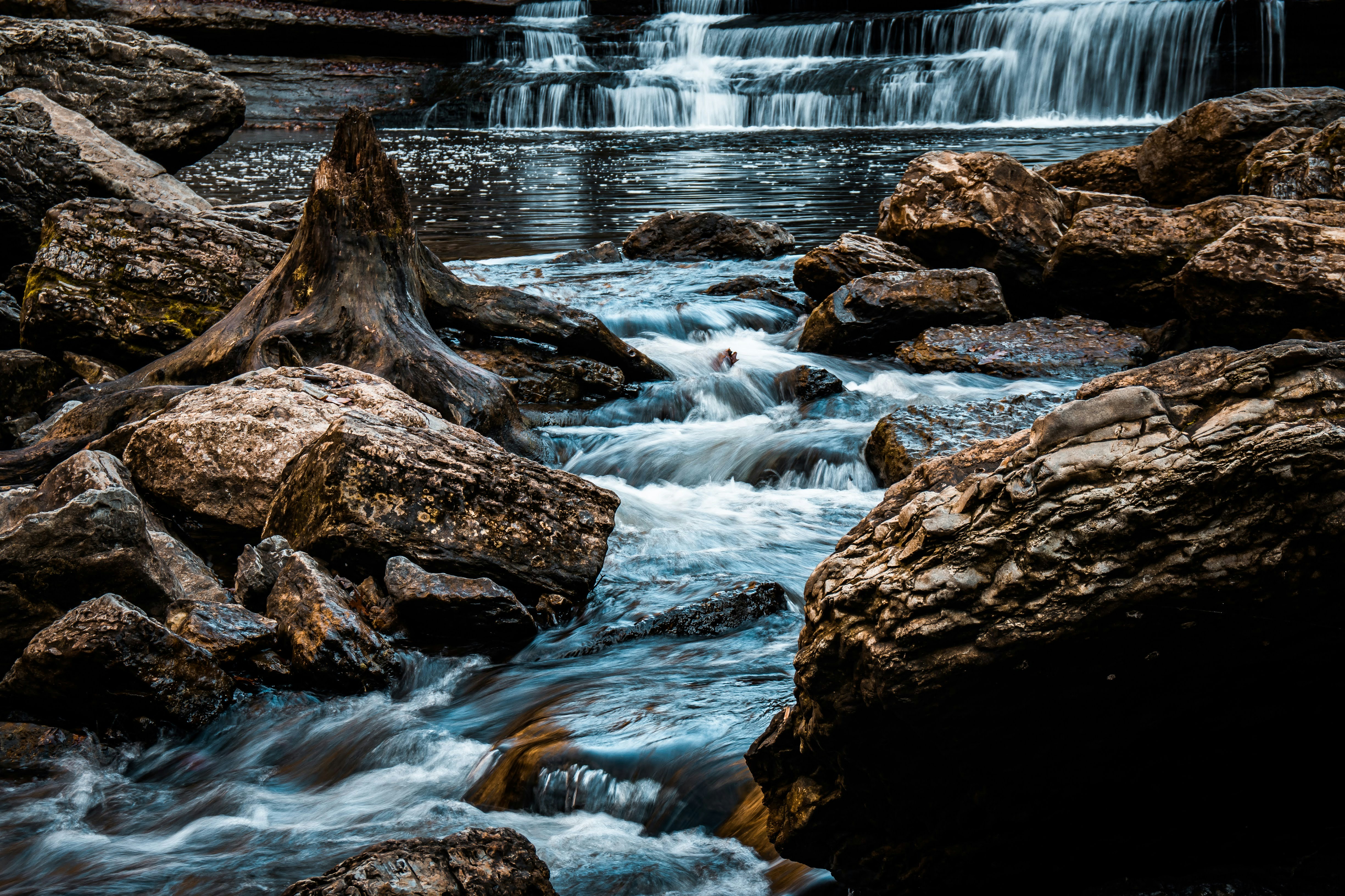 A waterfall over rocks photo – Free Nature Image on Unsplash