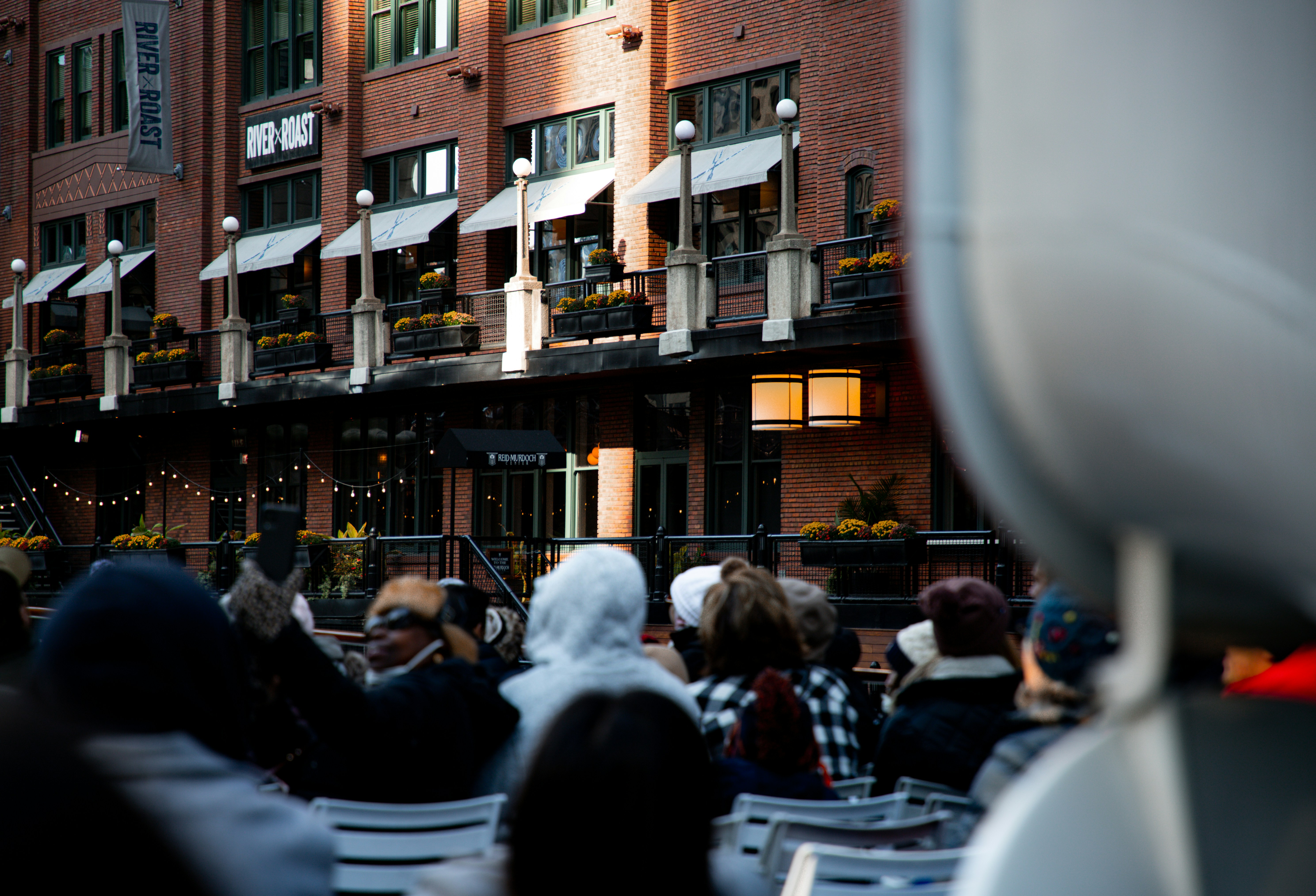 a group of people sitting outside