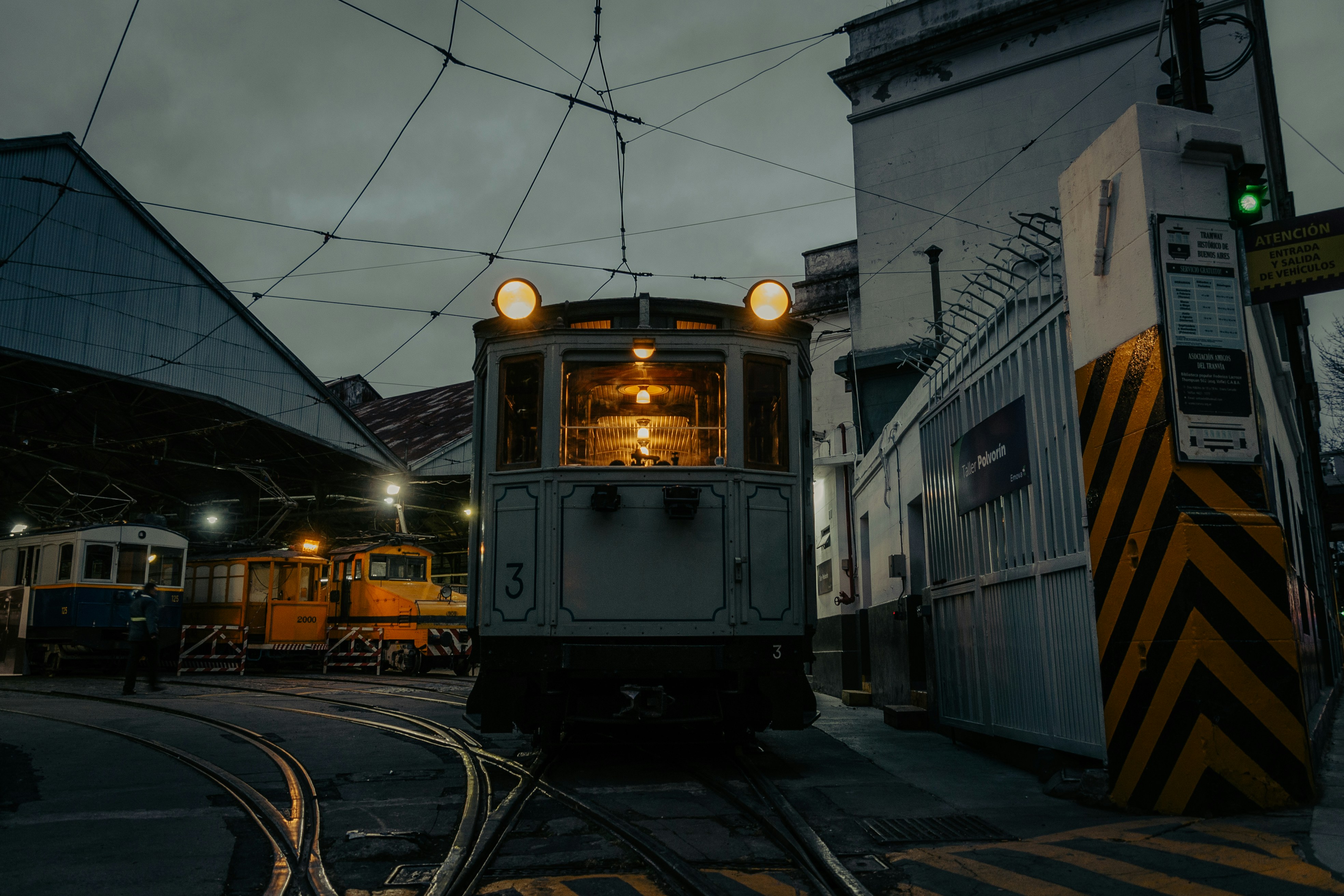 Headlights at Dusk: The Central Tram in a Silent Depot