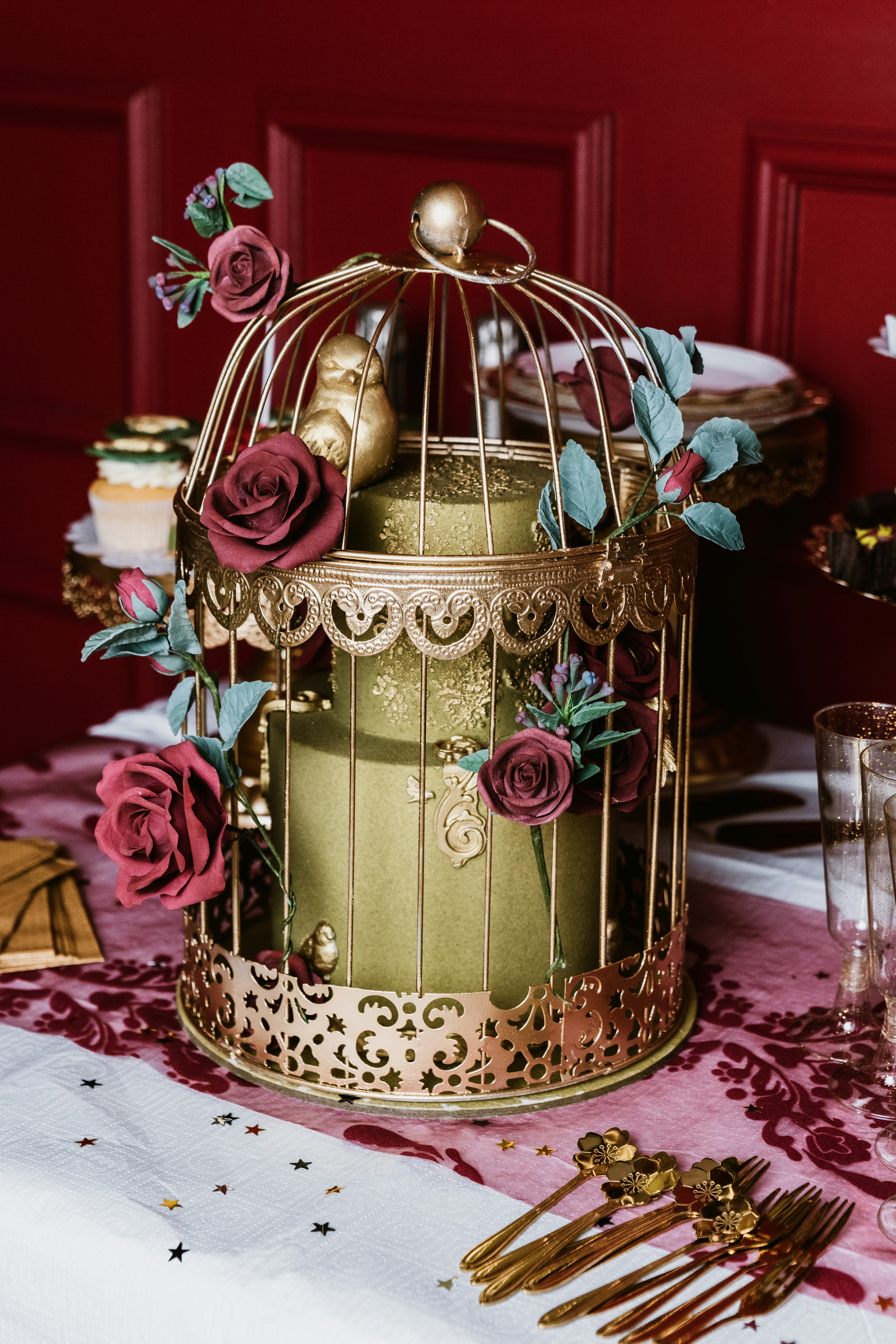 Roses in a Gilded Cage: a Green-Cake Centerpiece on Velvet Red