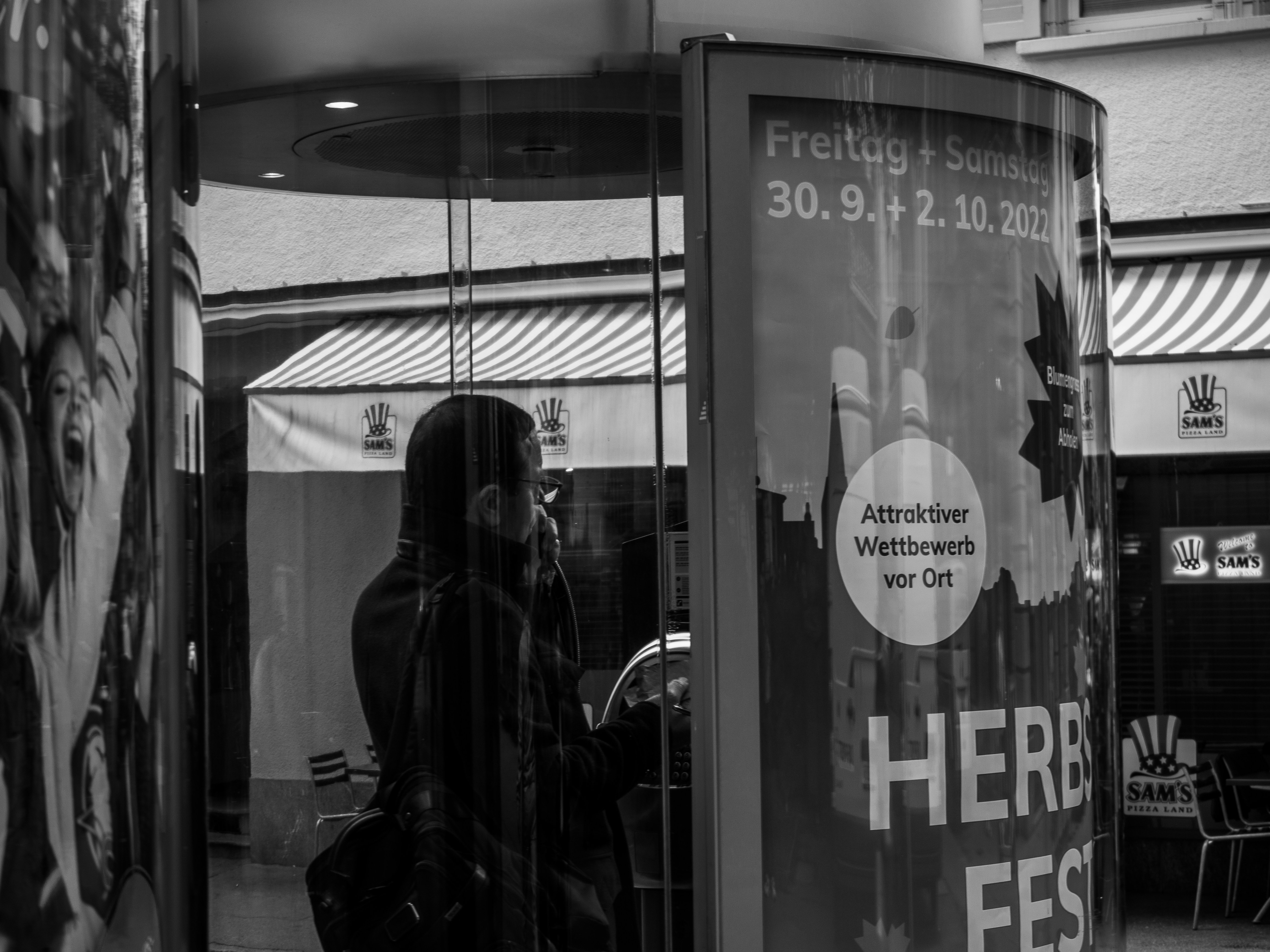 A person standing next to a sign photo – Free Woman Image on Unsplash