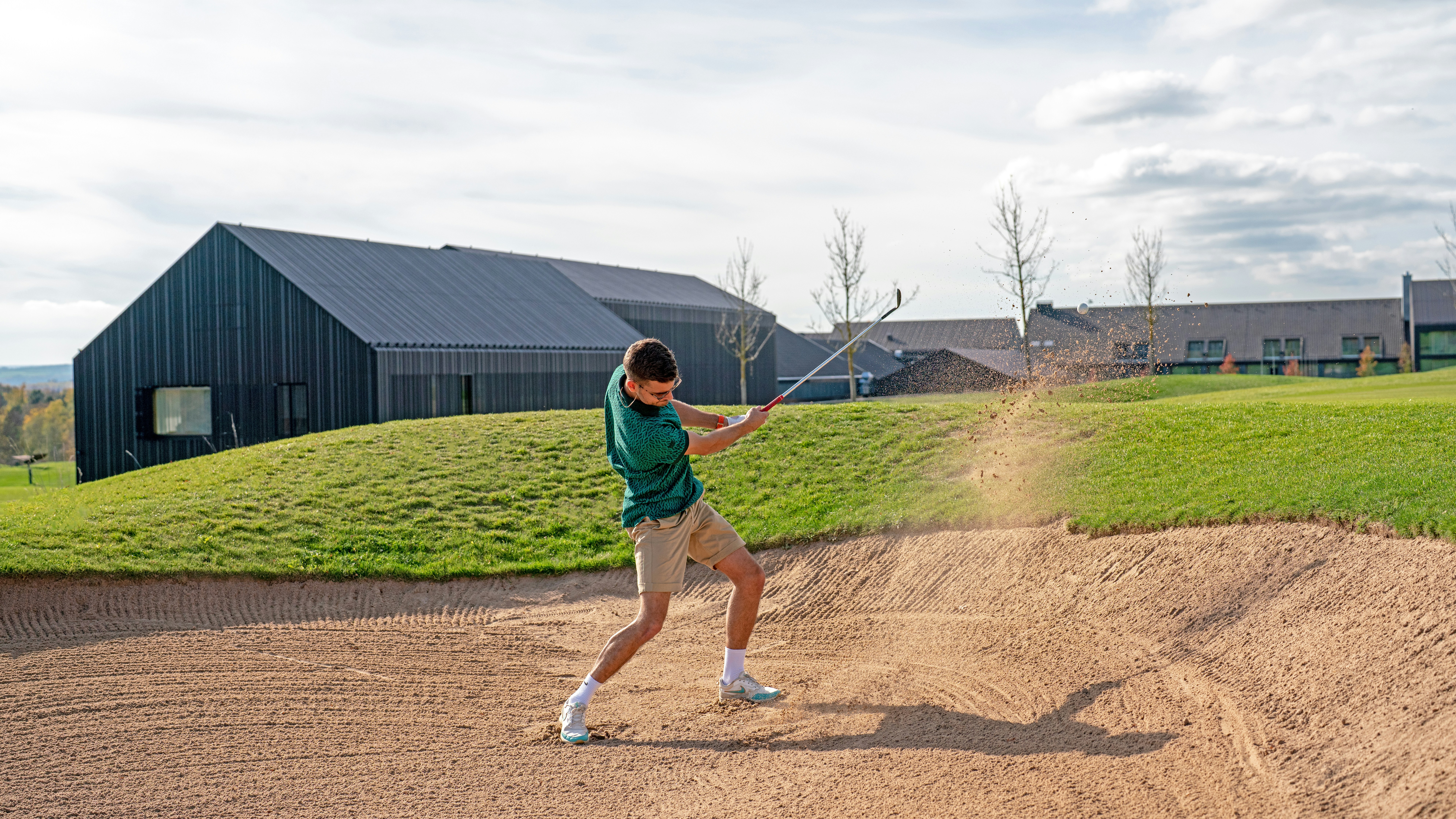 Dust and Drive: A Focused Sand Shot on a Quiet Course
