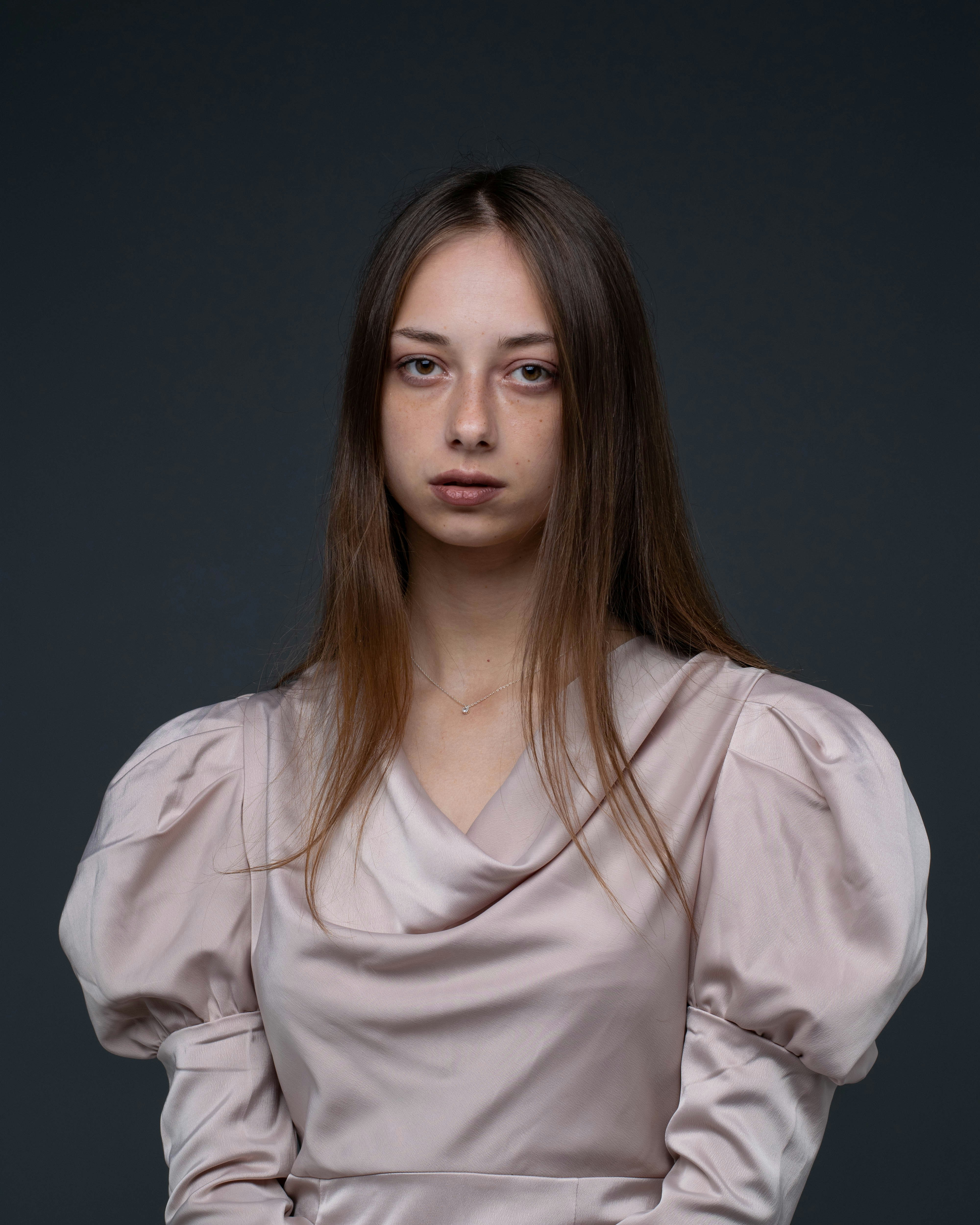 Contemplation in Satin: Studio Portrait with a Quiet Gaze