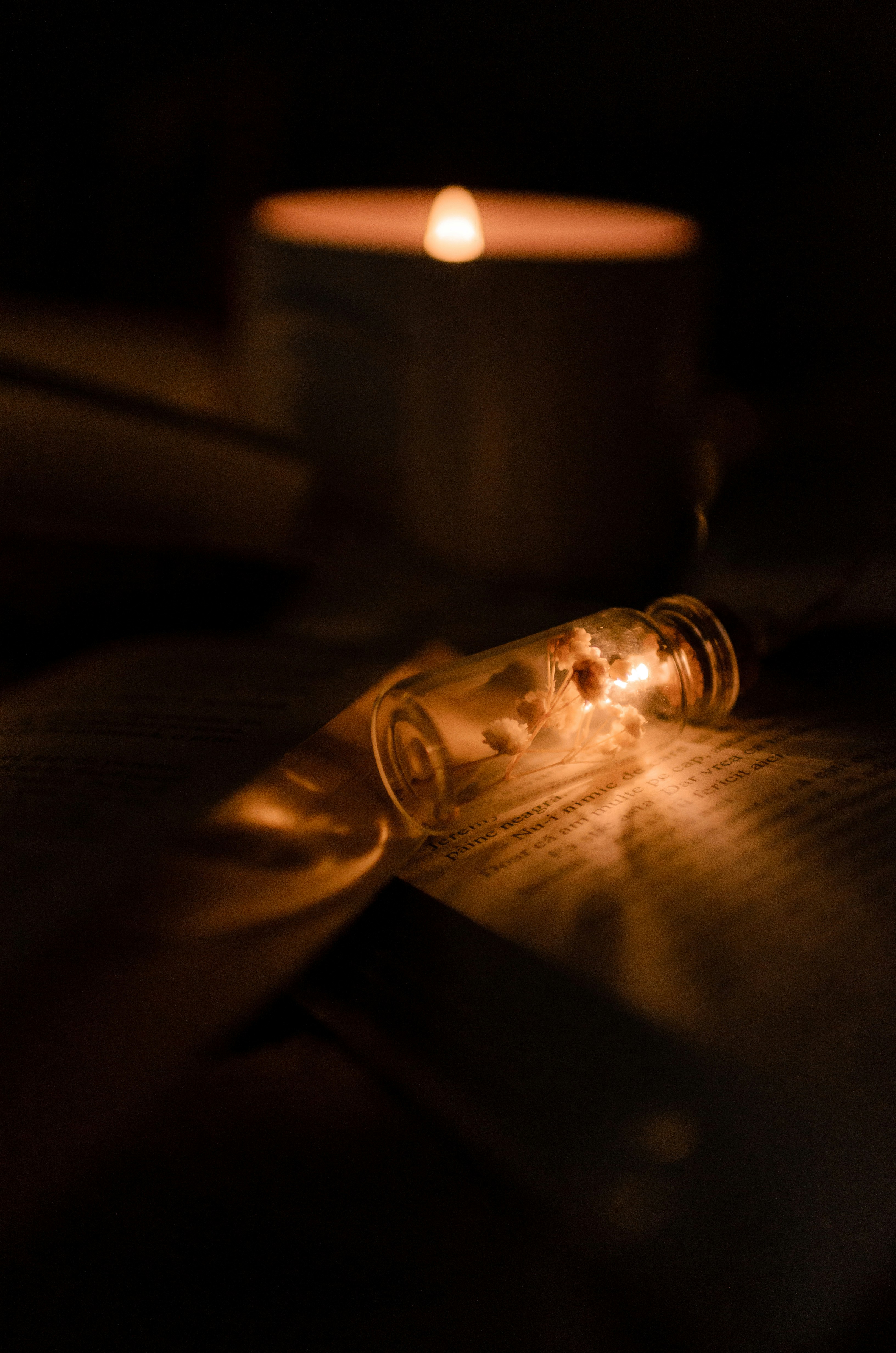 A Quiet Glow: The Candlelight on a Pierced Bottle
