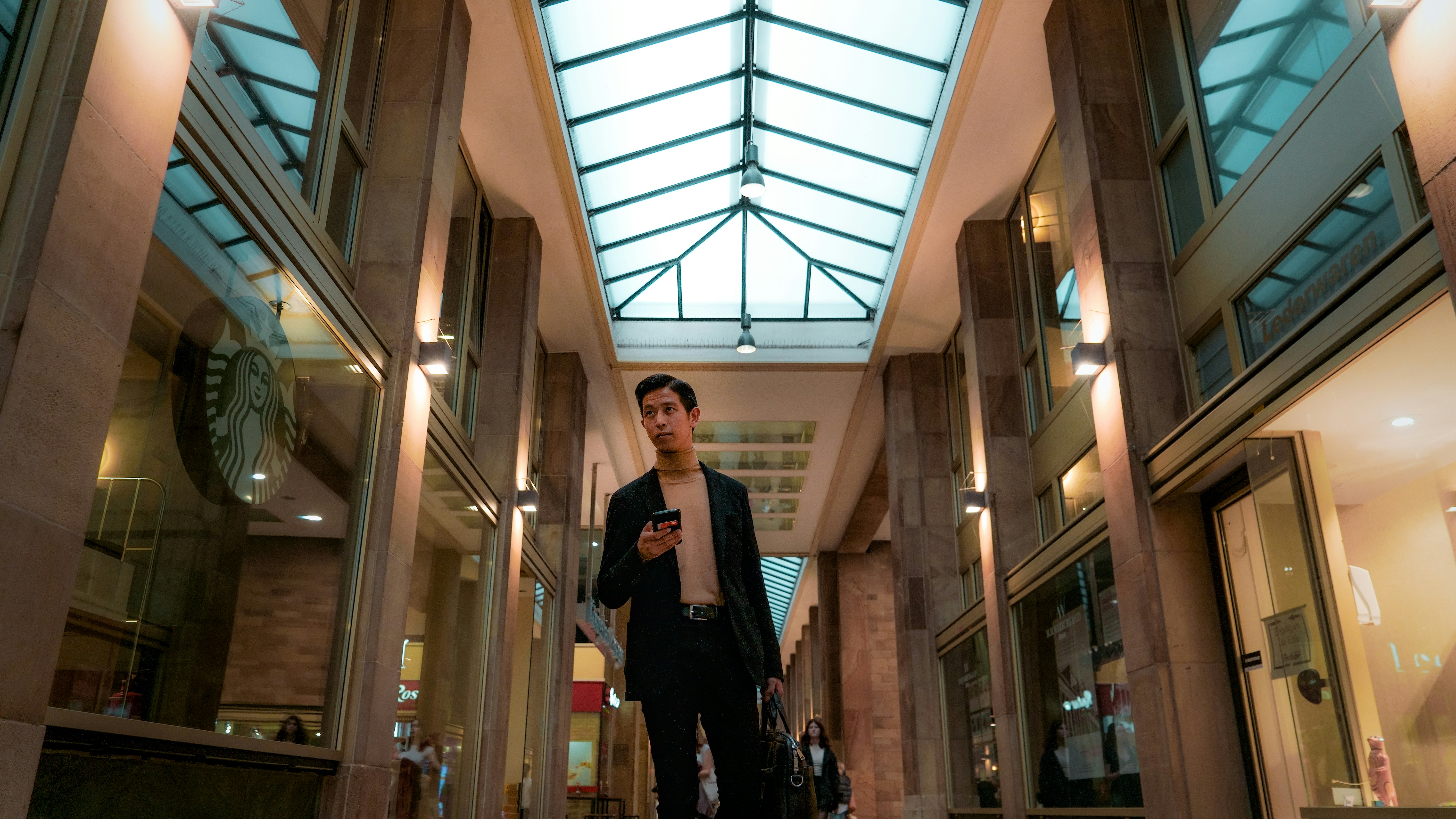 A person standing in a hallway photo – Free Office Image on Unsplash