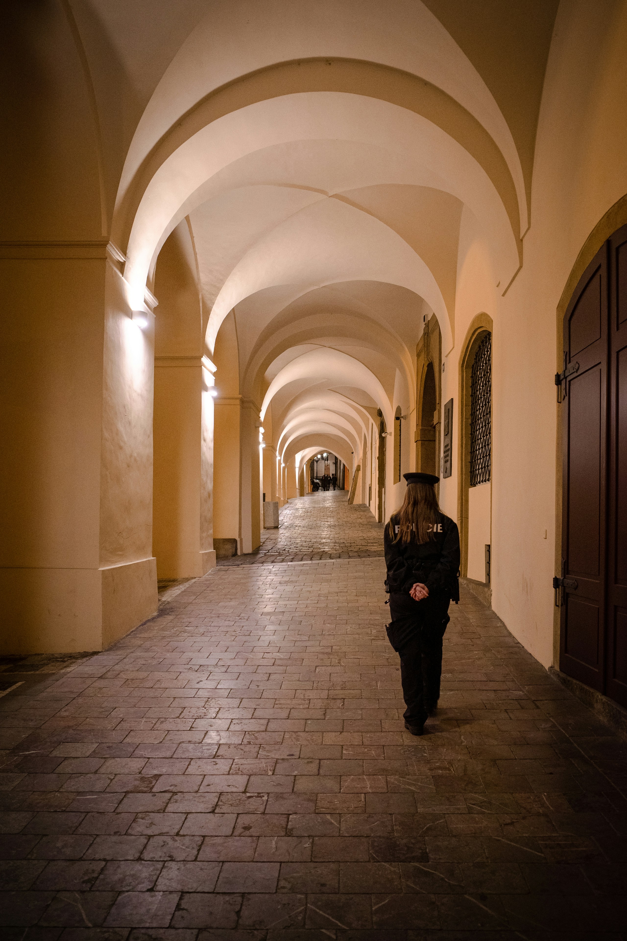 Arched Corridor Stroll: A Quiet Walk Through Warm Castles