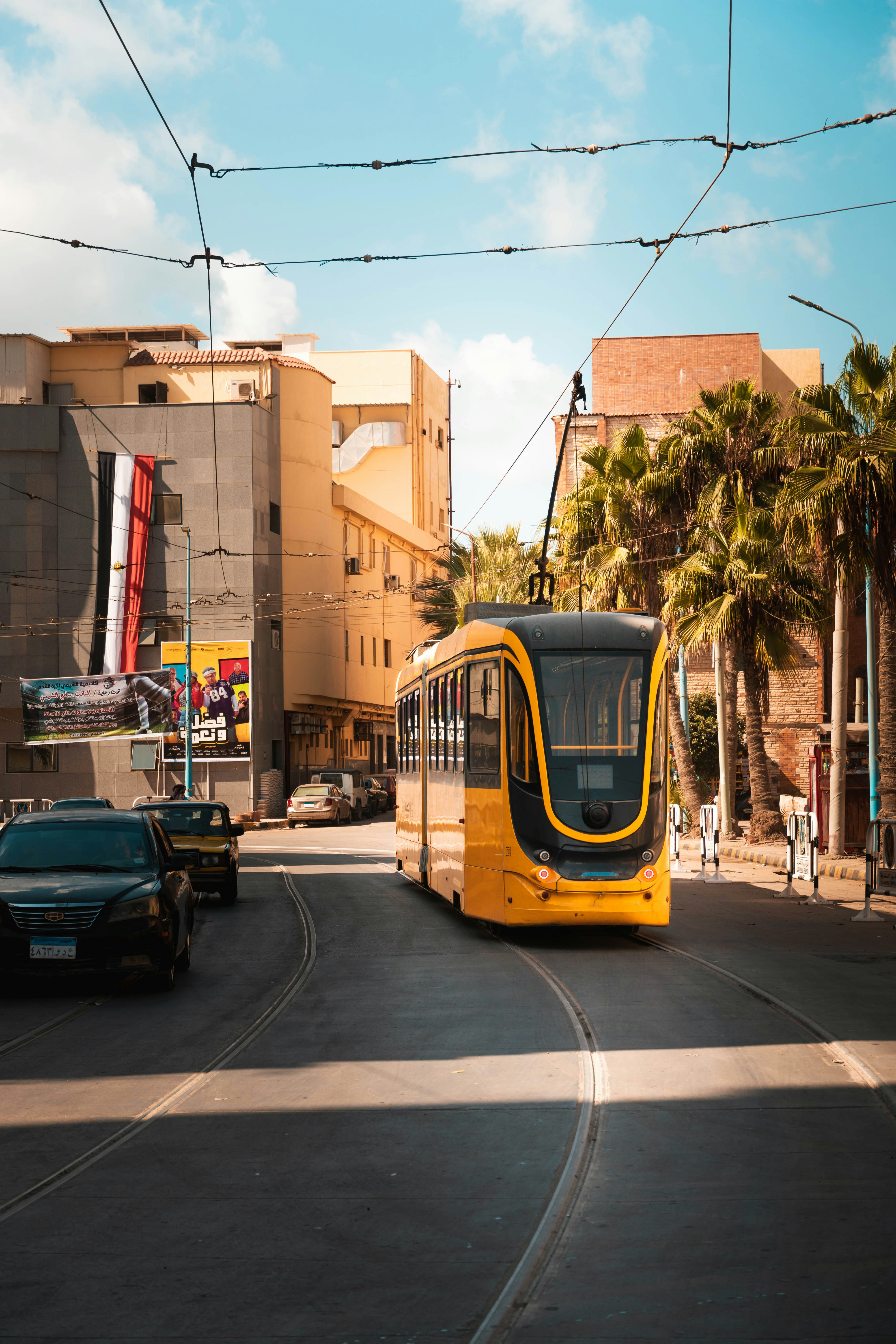 a yellow trolley on a street