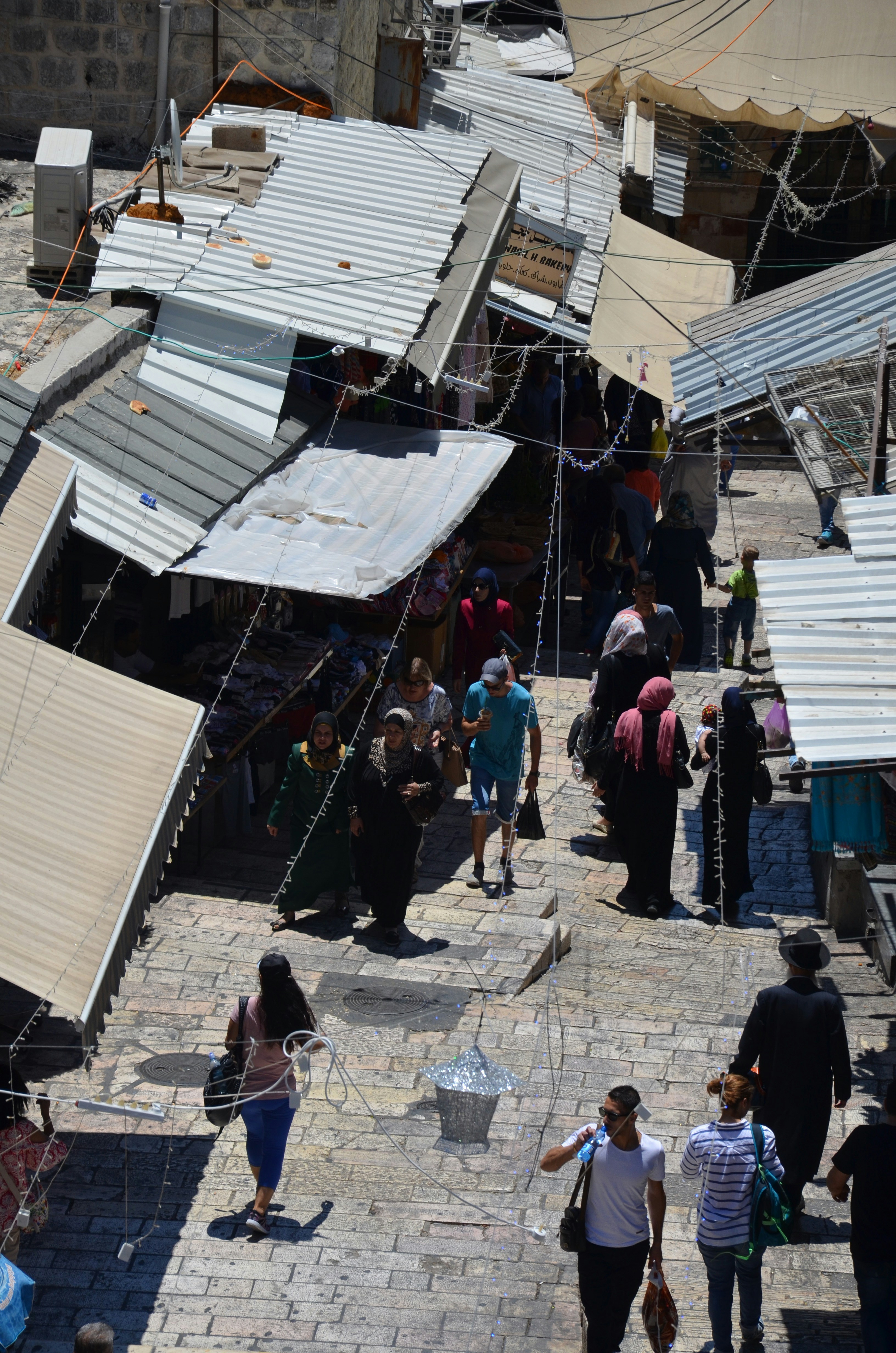 A group of people standing outside a building that is being constructed ...