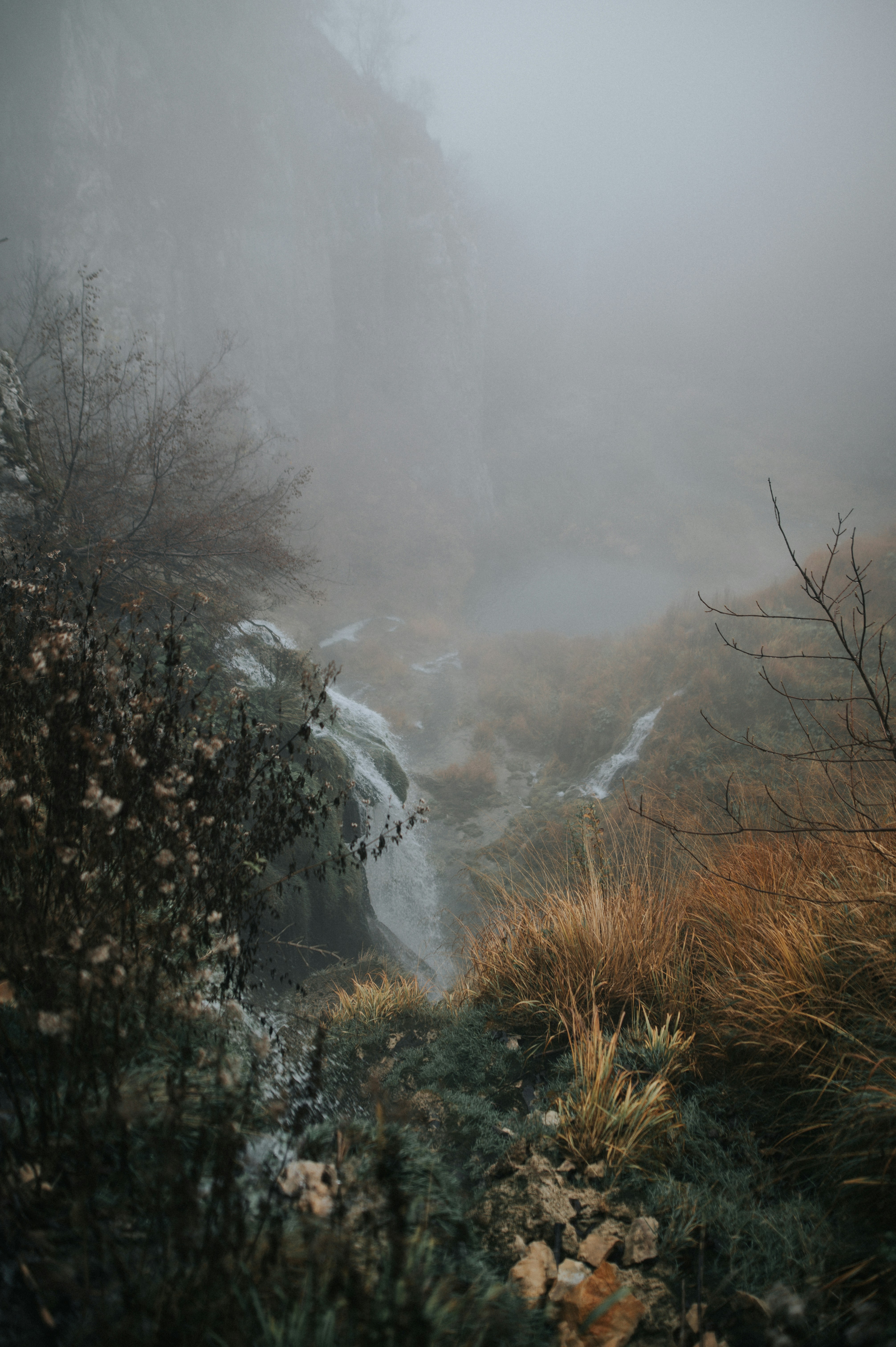 Moody Cascade Shrouded in Mist