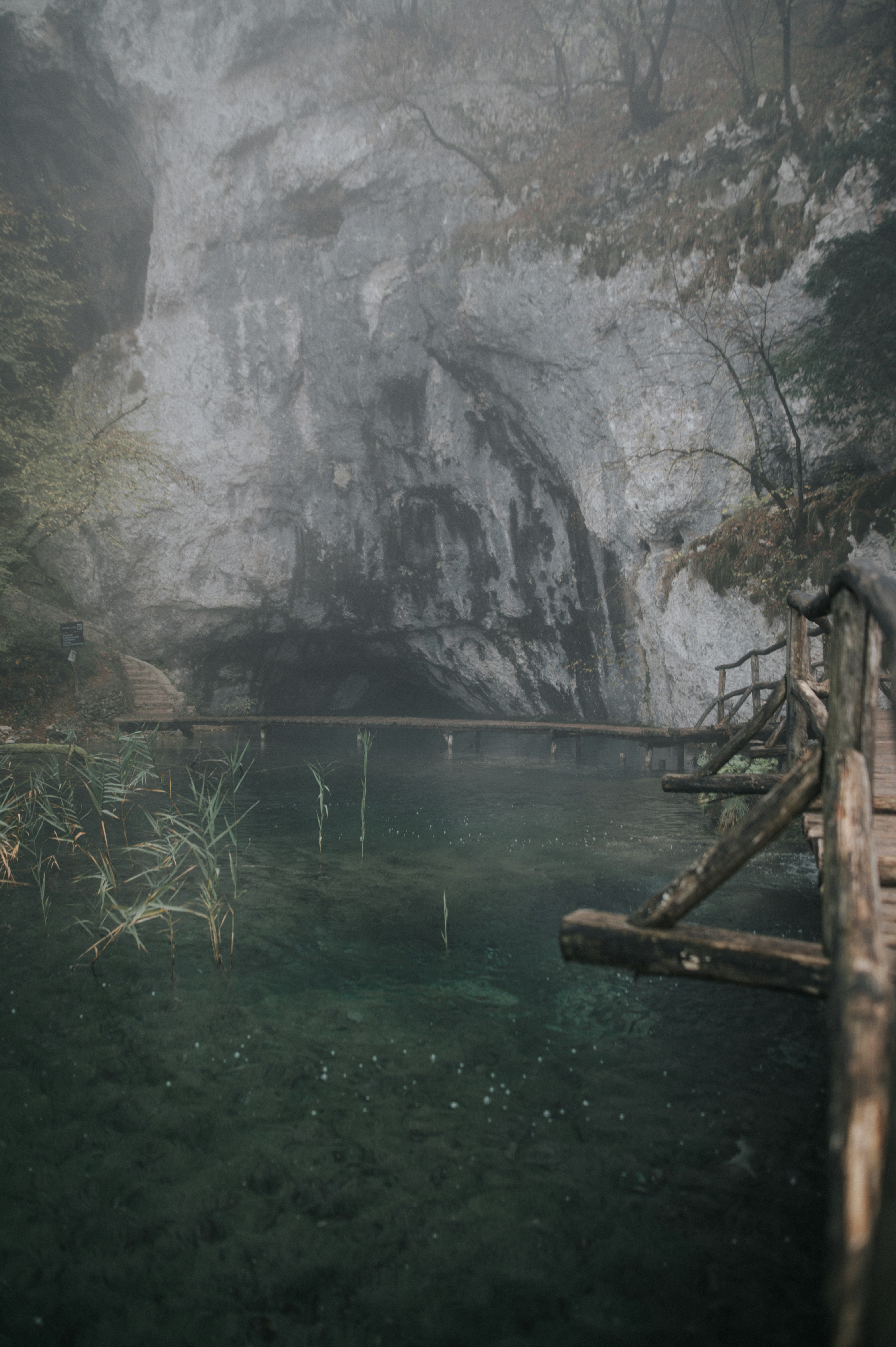 Veiled Gorge: Turquoise Pool Beneath Weathered Walkways