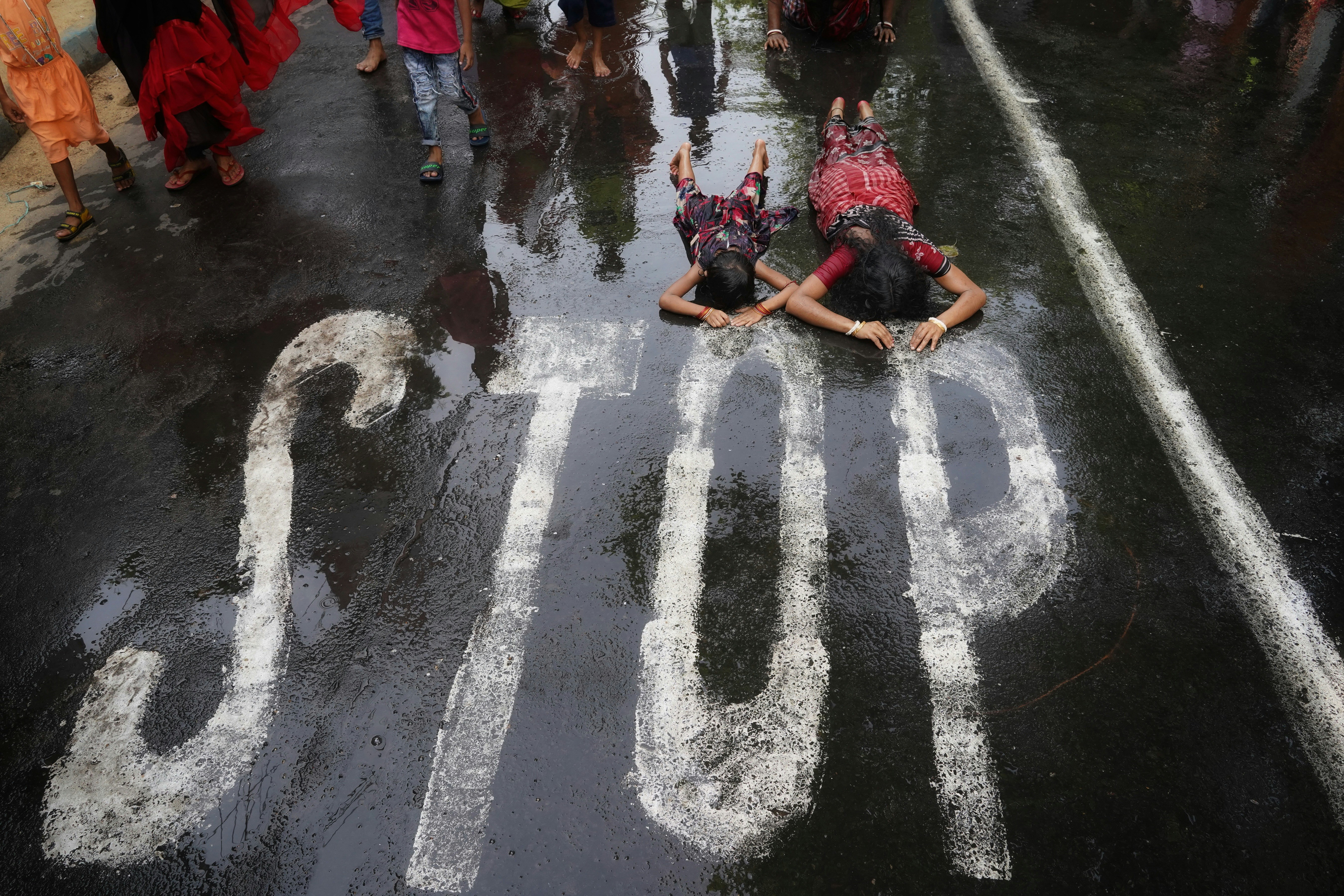 Women are performing Dondi an old Bengal ritual on the street of Kolkata during worshiping Goddess Sitala.