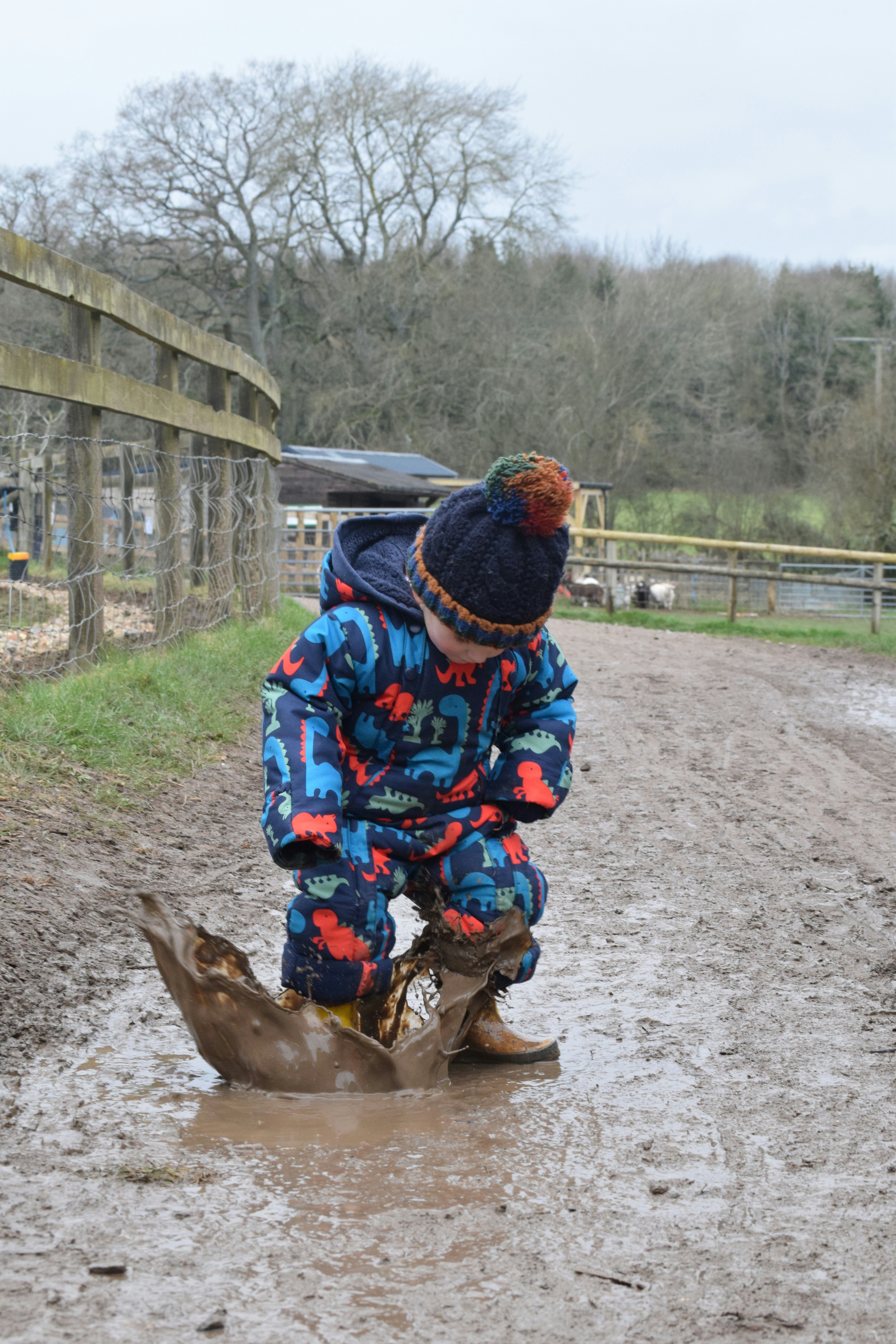 A person kneeling in a puddle photo – Free Boy Image on Unsplash