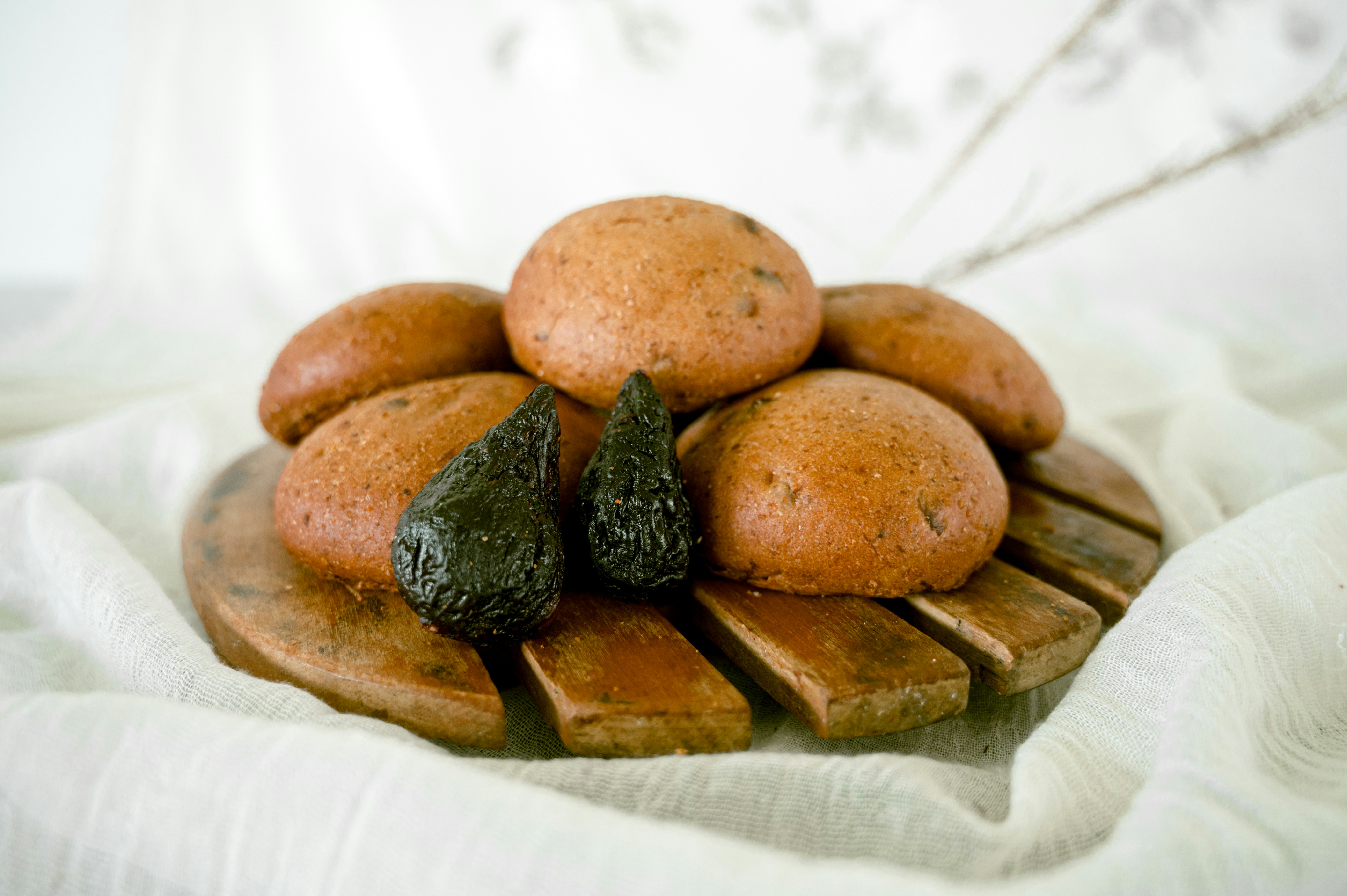 Cross-Stacked Cookies on a Rustic Plank