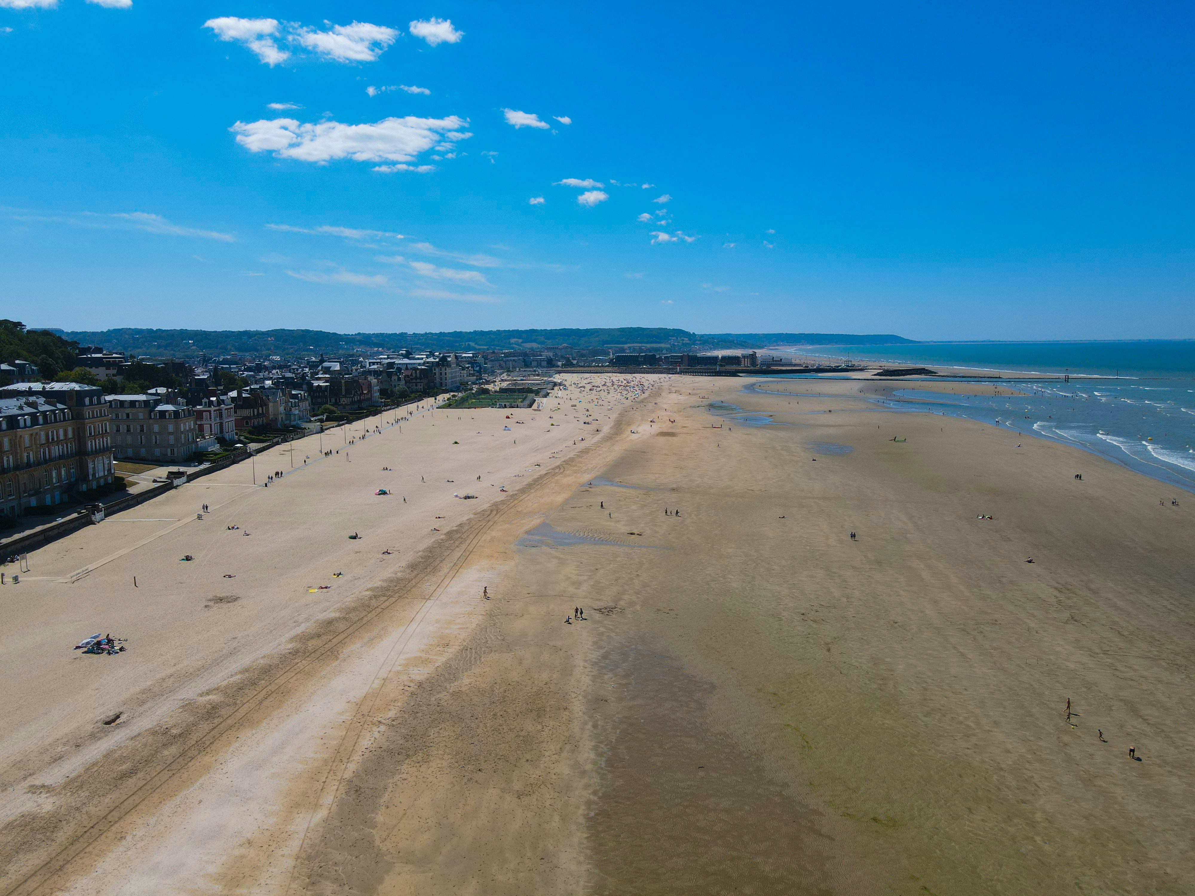Coastal Frontlines: Drone View of Beach Promenade and Sea