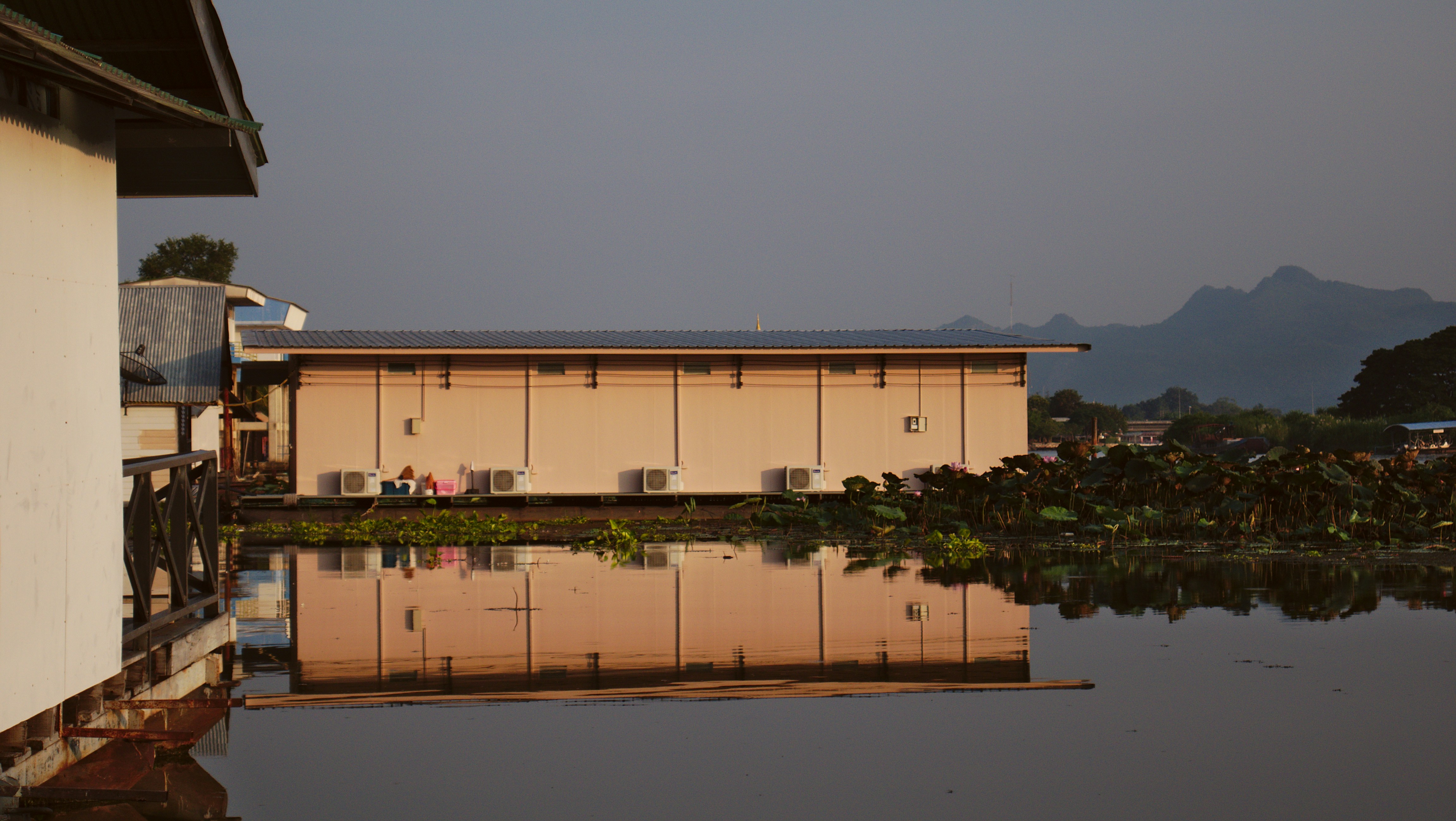 Still Water, Hidden Horizon: Lakeside Warehouse Reflections