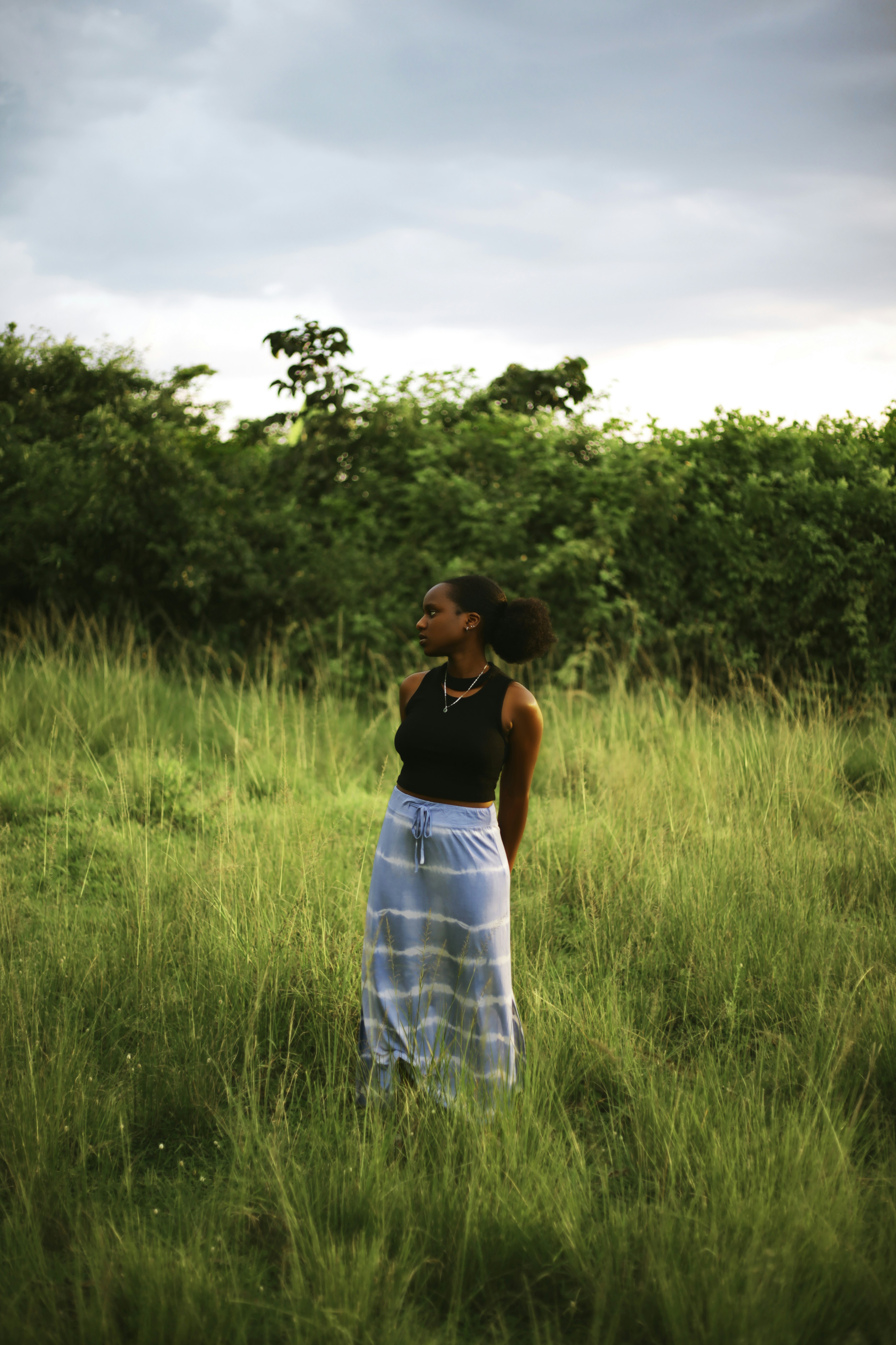 A person standing in a field of tall grass photo – Free Rwanda Image on ...