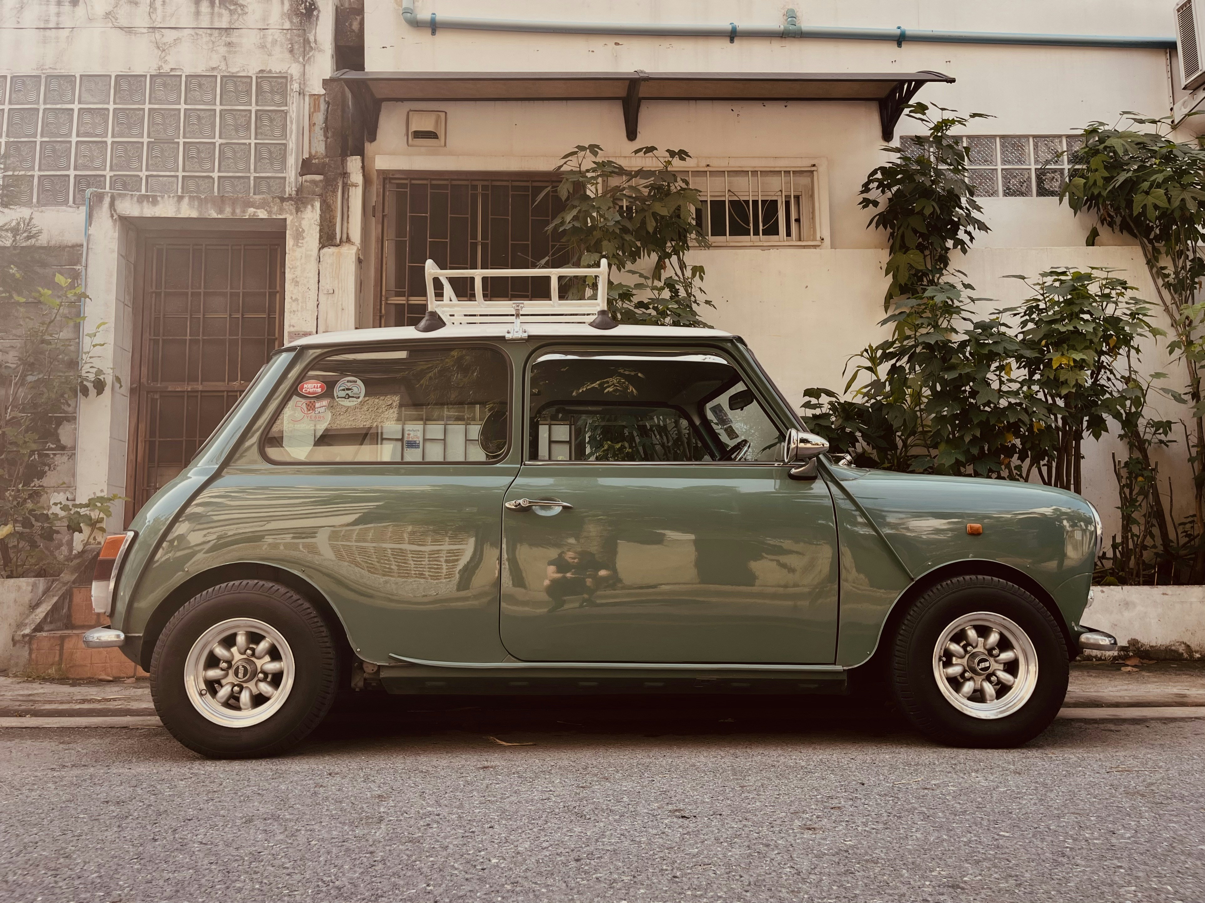 Olive Vintage Mini Cooper Anchors a Quiet Urban Street