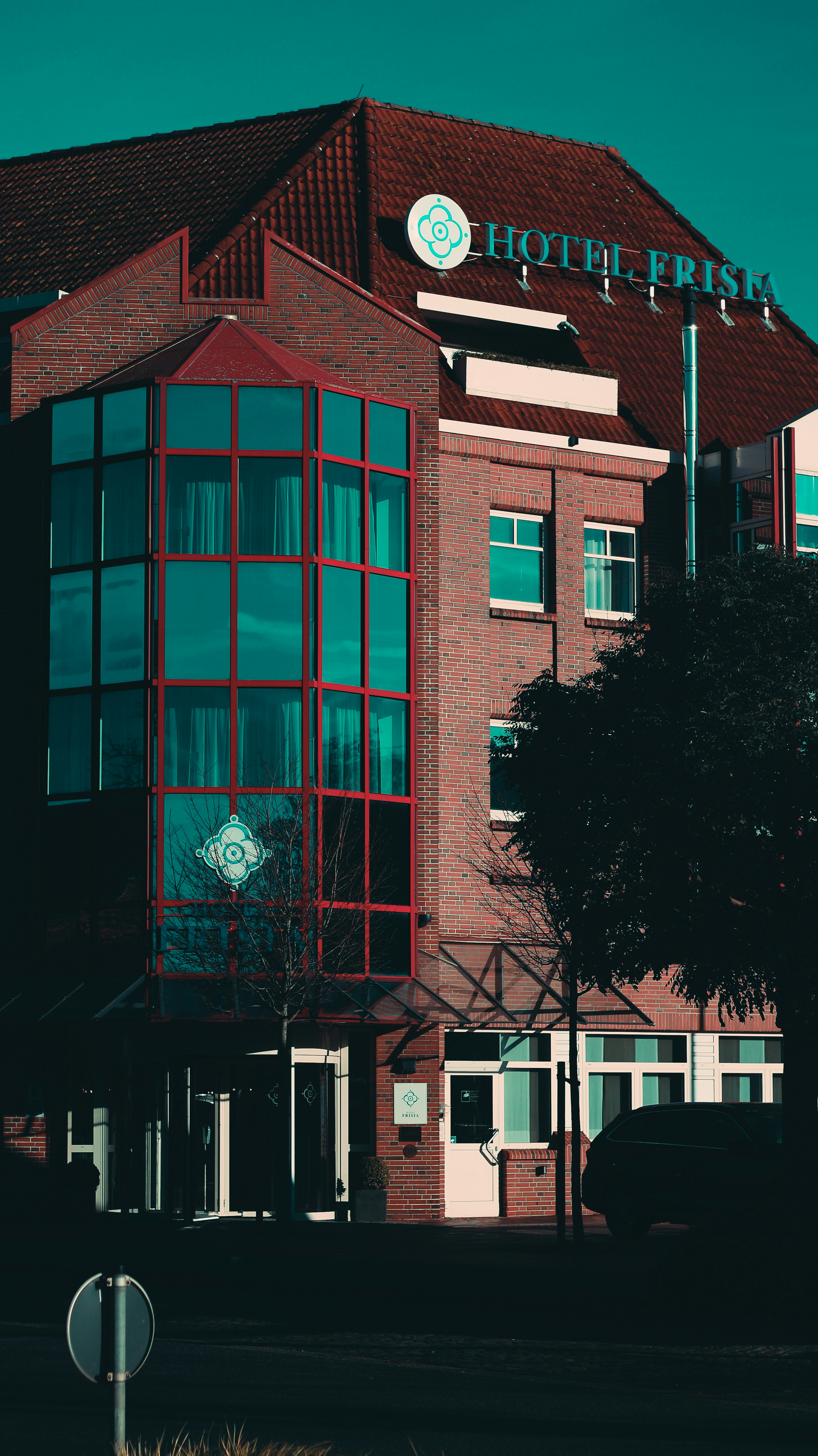 Brick Hotel Friese Under a Teal Sky