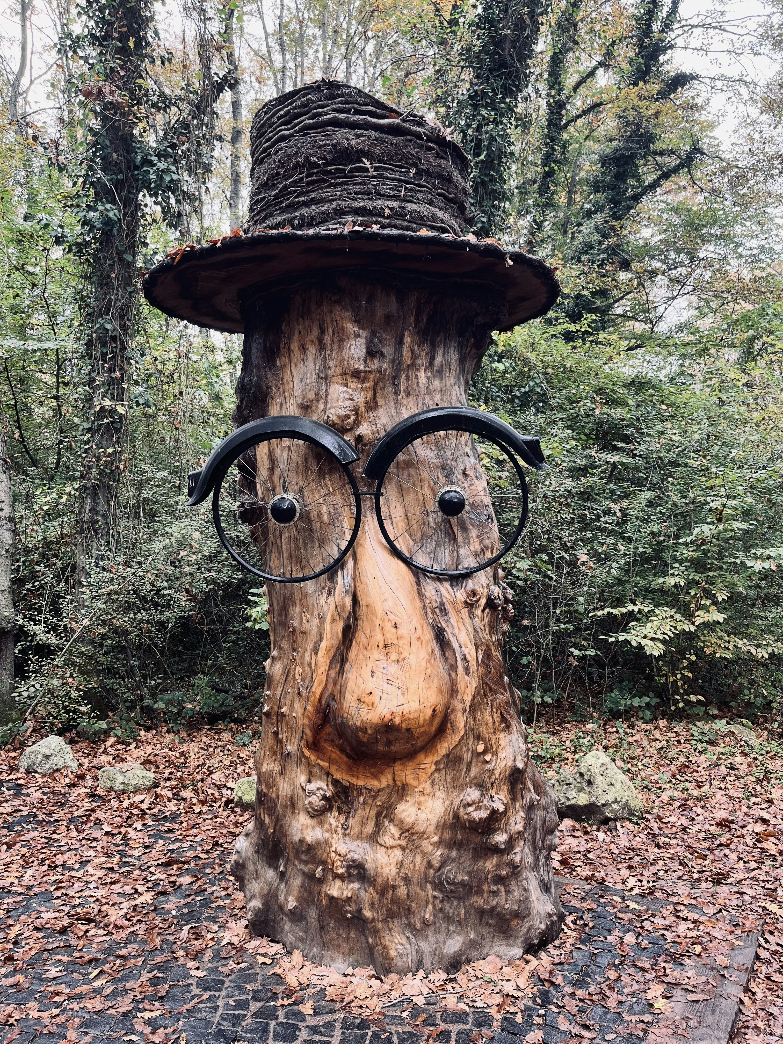 The Forest Philosopher: A Wood Sculpture with Round Glasses