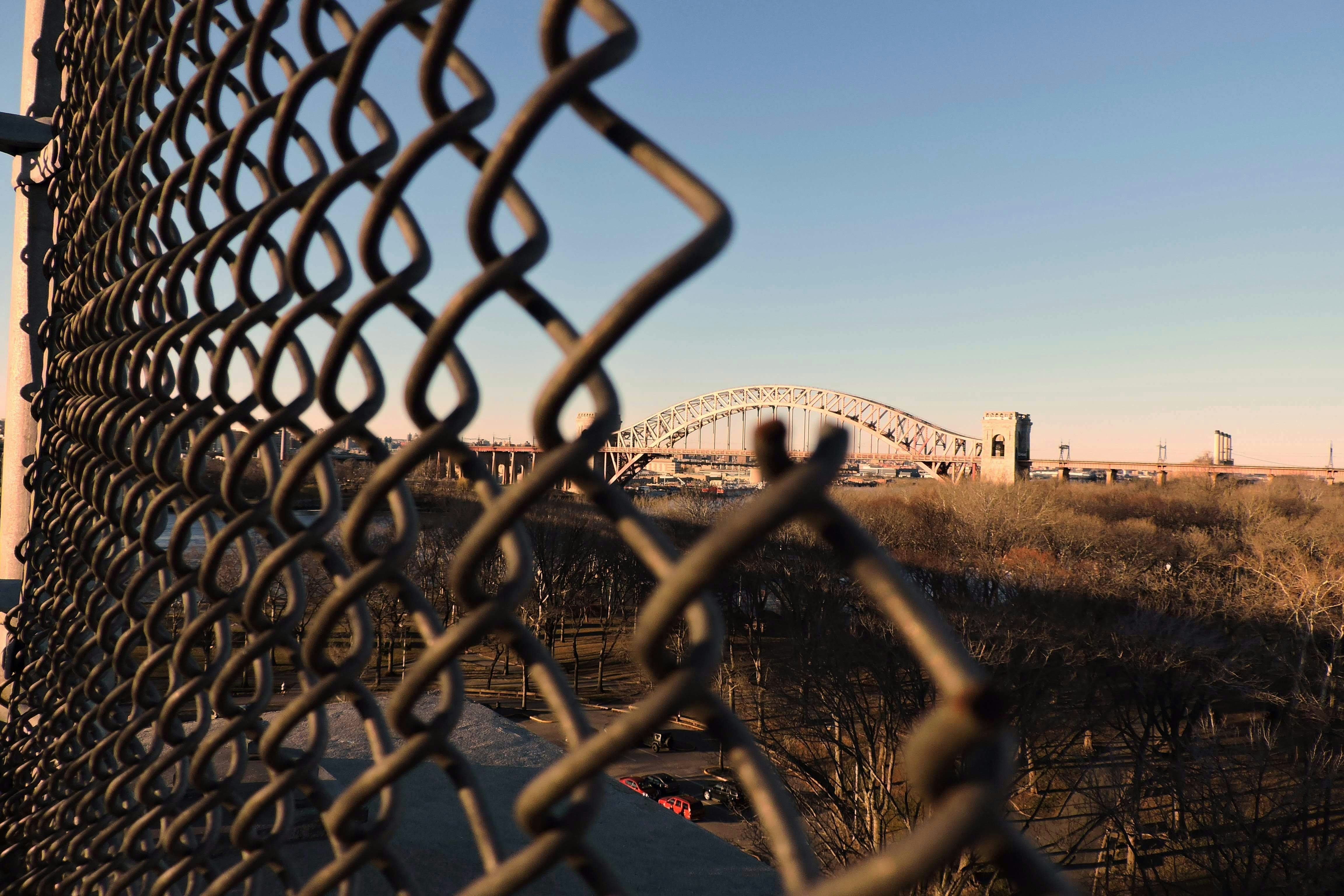 Weave and Span: Sunset View Framed by Chain-Link
