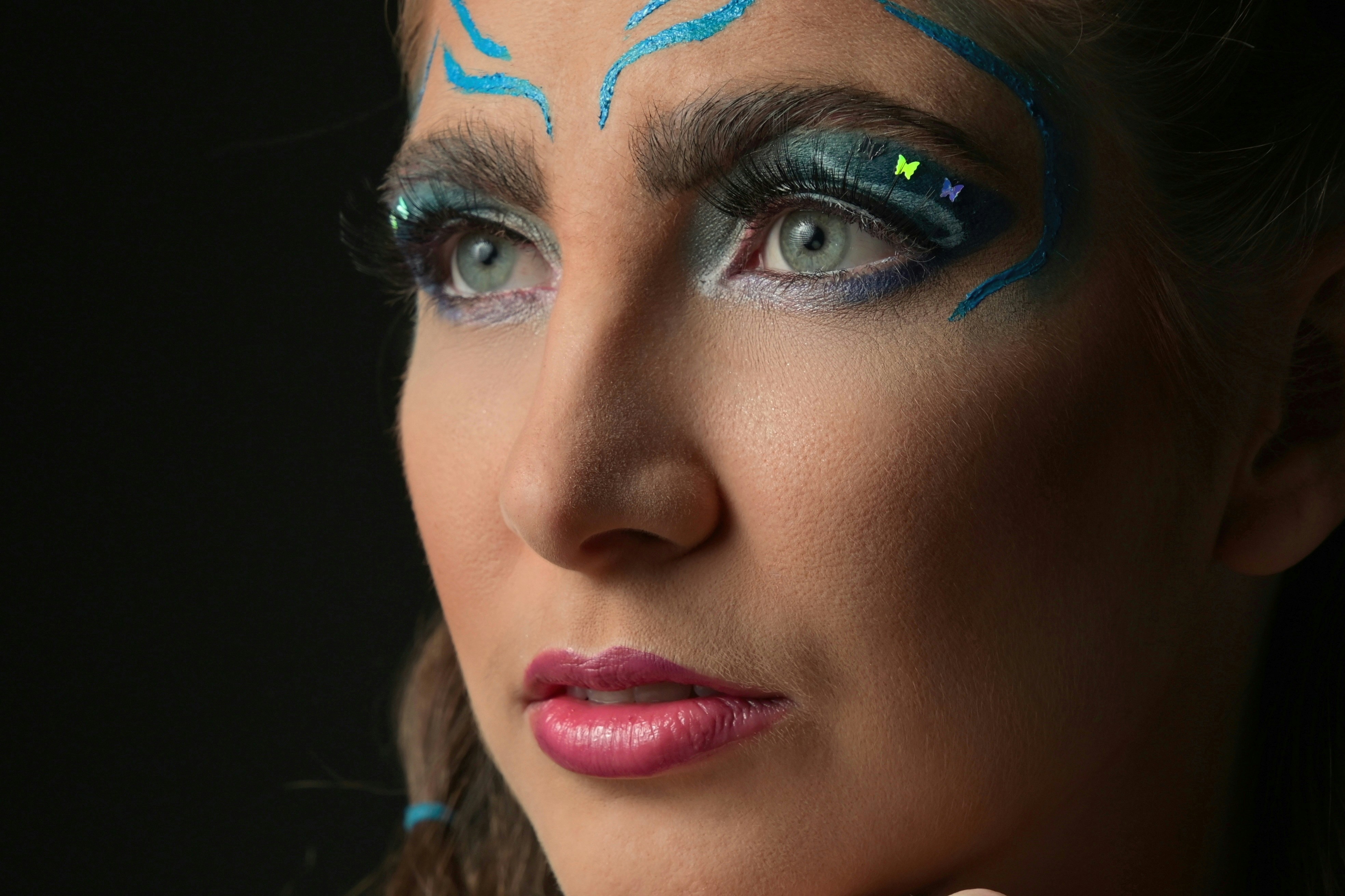 Azure Strands: Painted Gaze Under Spotlight