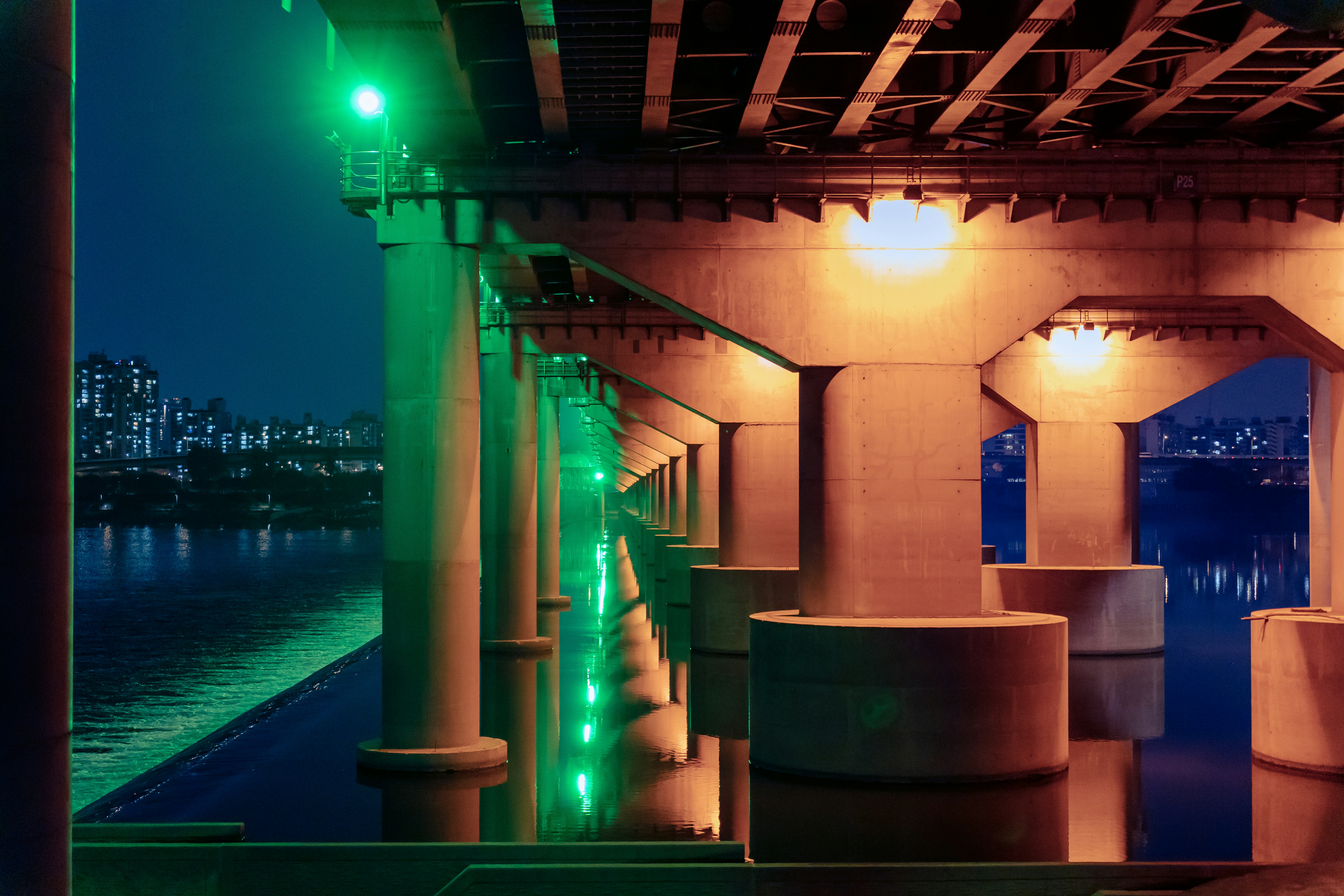 Neon-Green Corridor Beneath a Night Bridge