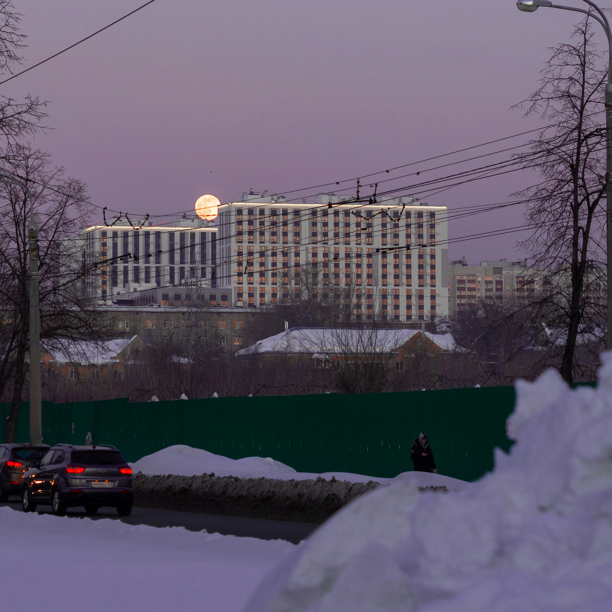 Moon Above the Grid: Dusk Snow and a Purple Skyline