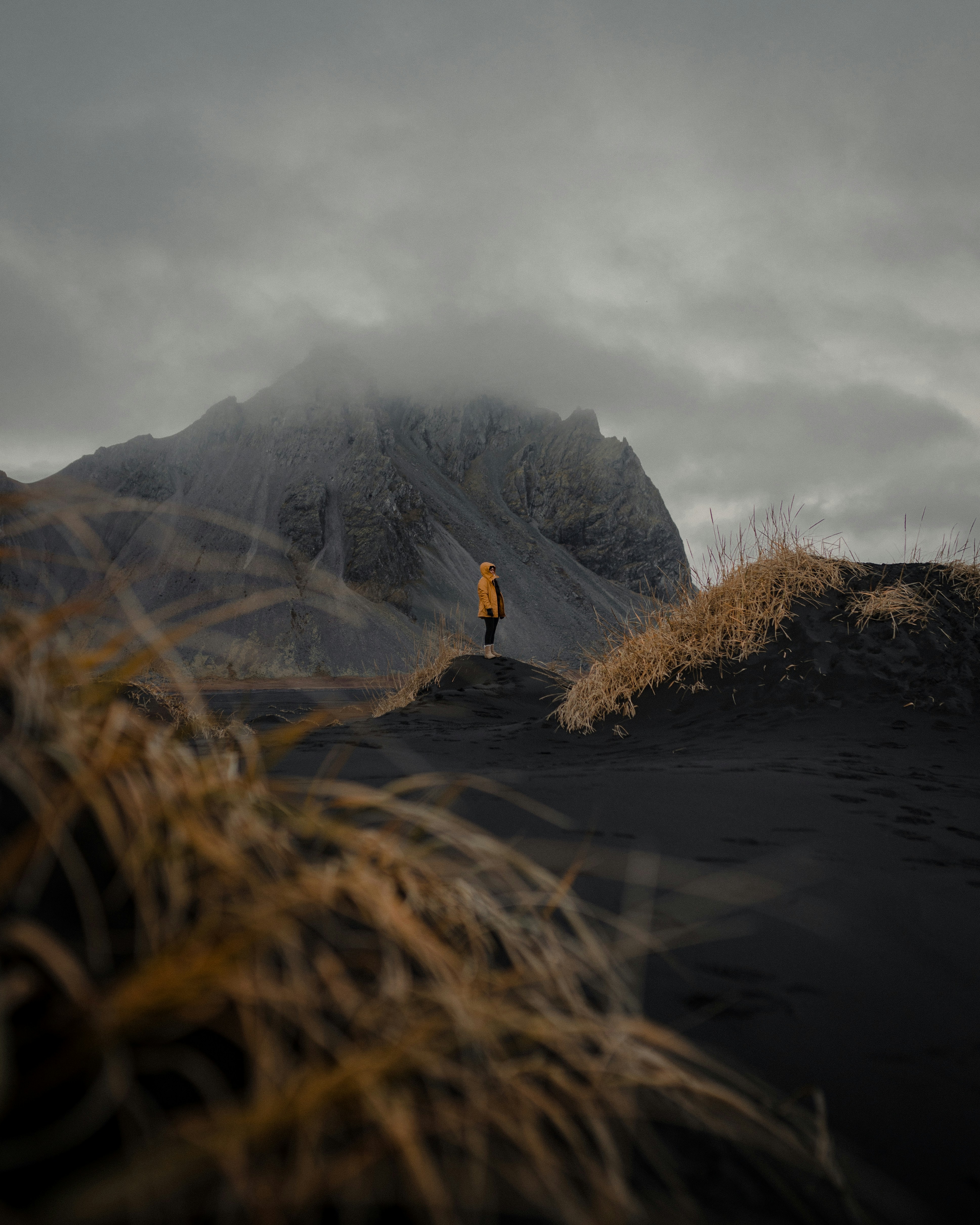 A person walking on a path in a foggy landscape photo – Free Nature ...