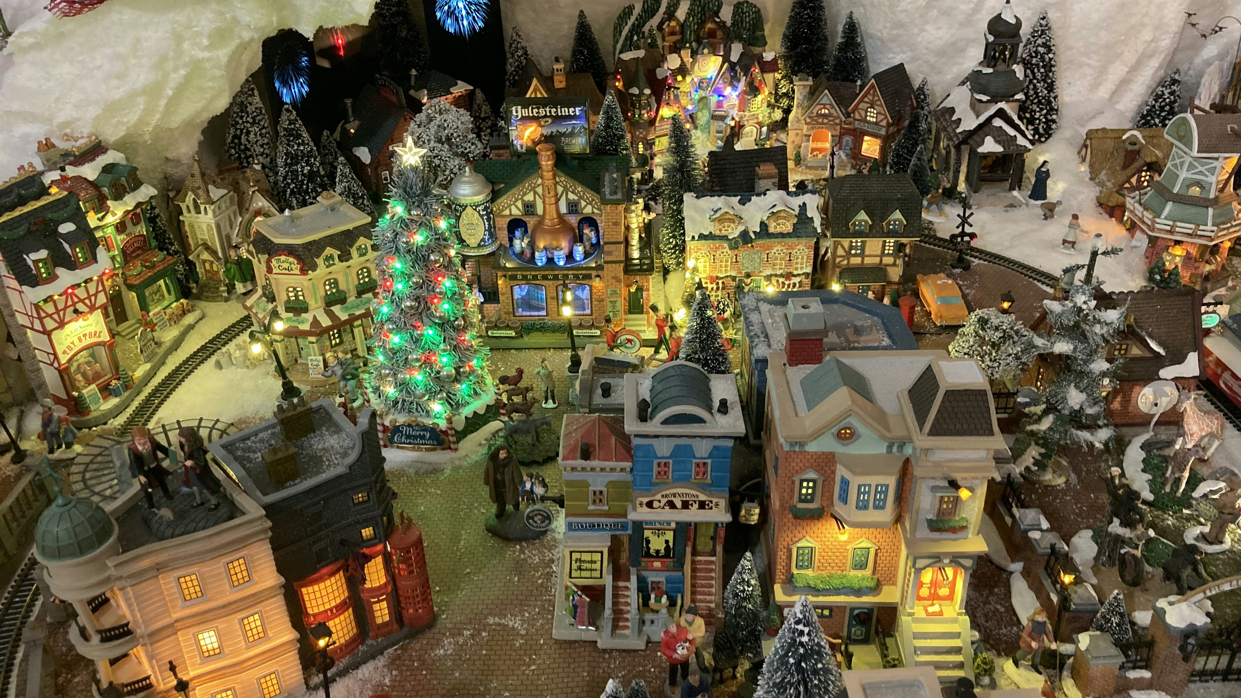 Snow-Dusted Christmas Village: Neon Lights in a Miniature Night