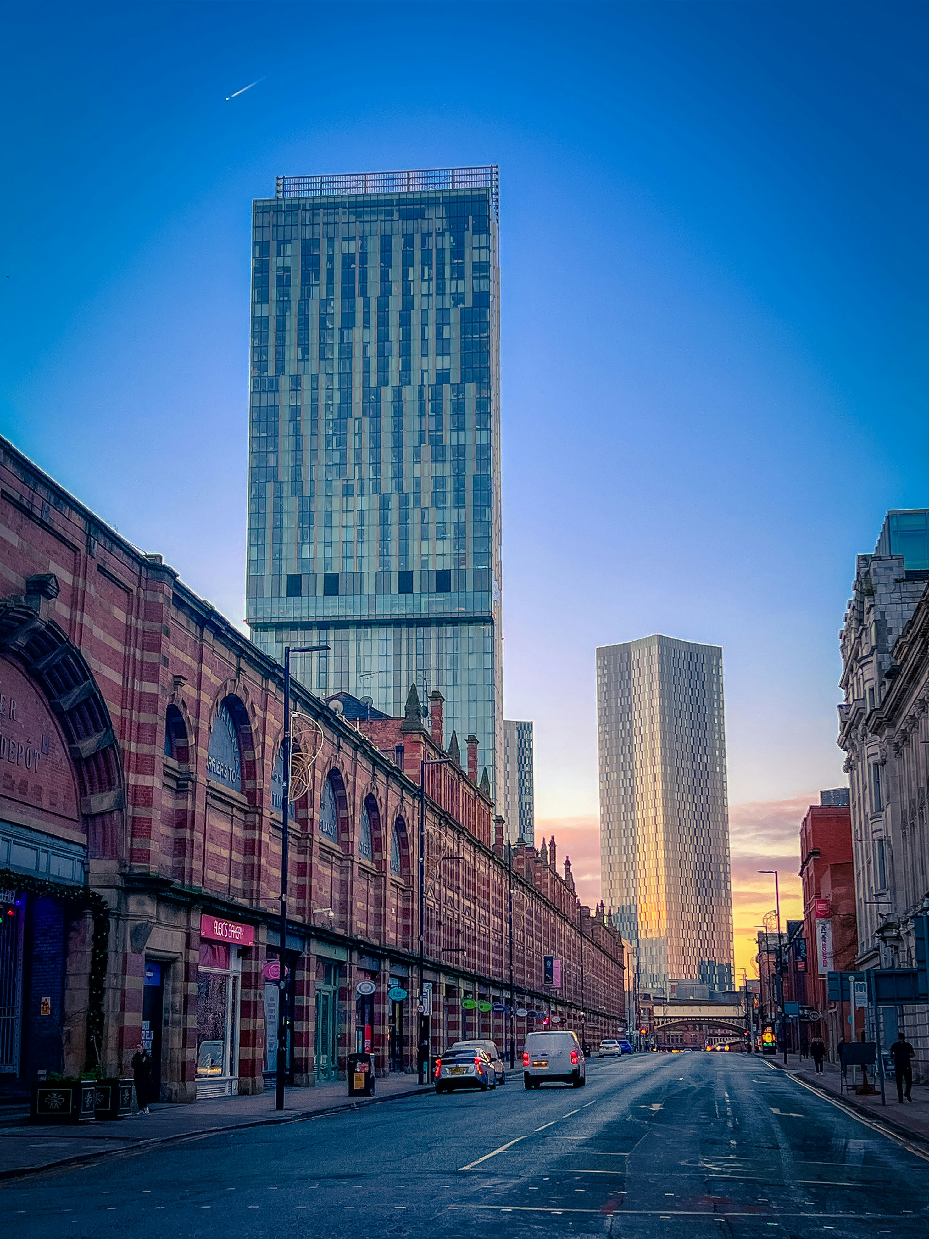 A street with buildings on either side with Beetham Tower, Manchester ...