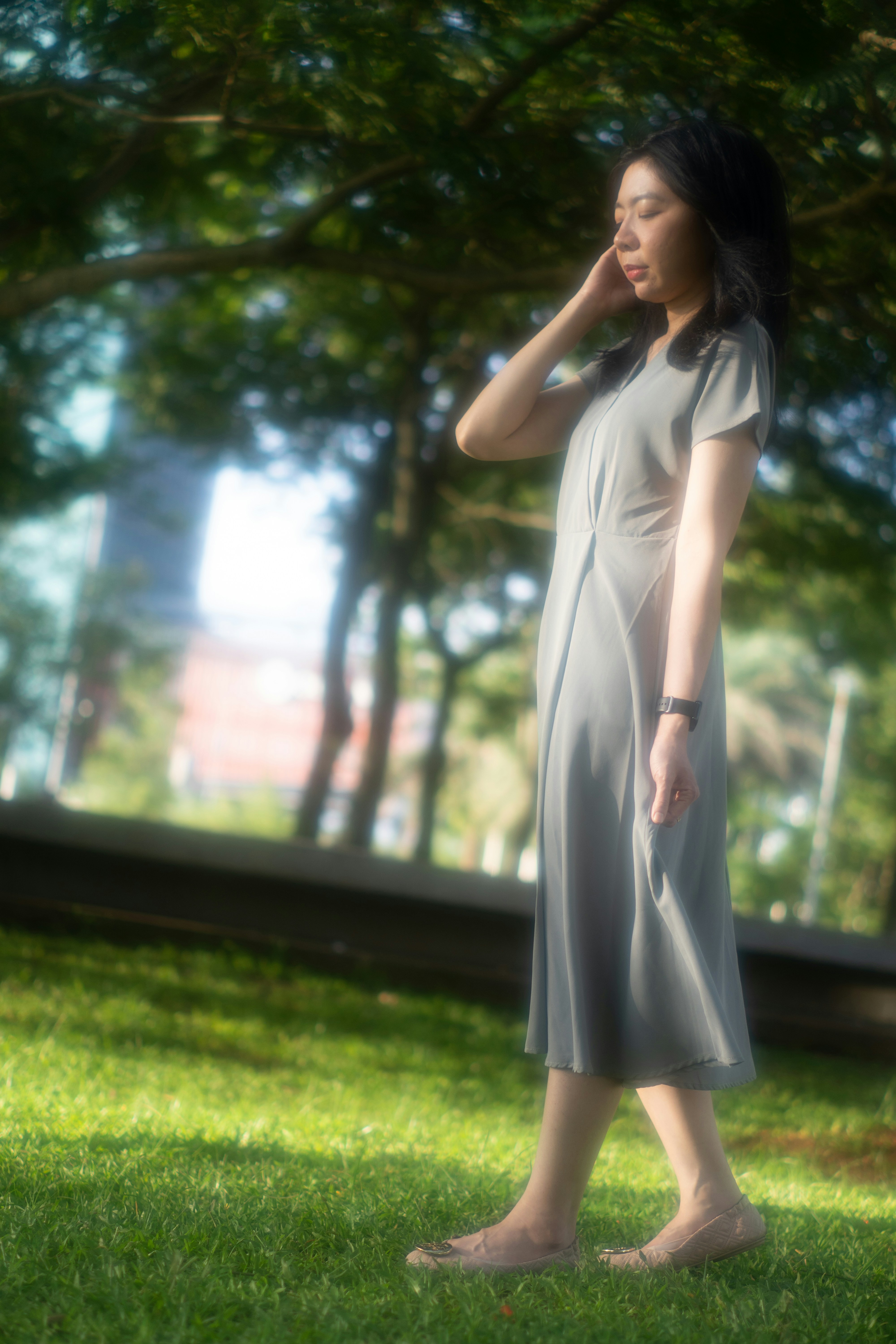 Dappled Grace: A Quiet Park Portrait in Soft Focus
