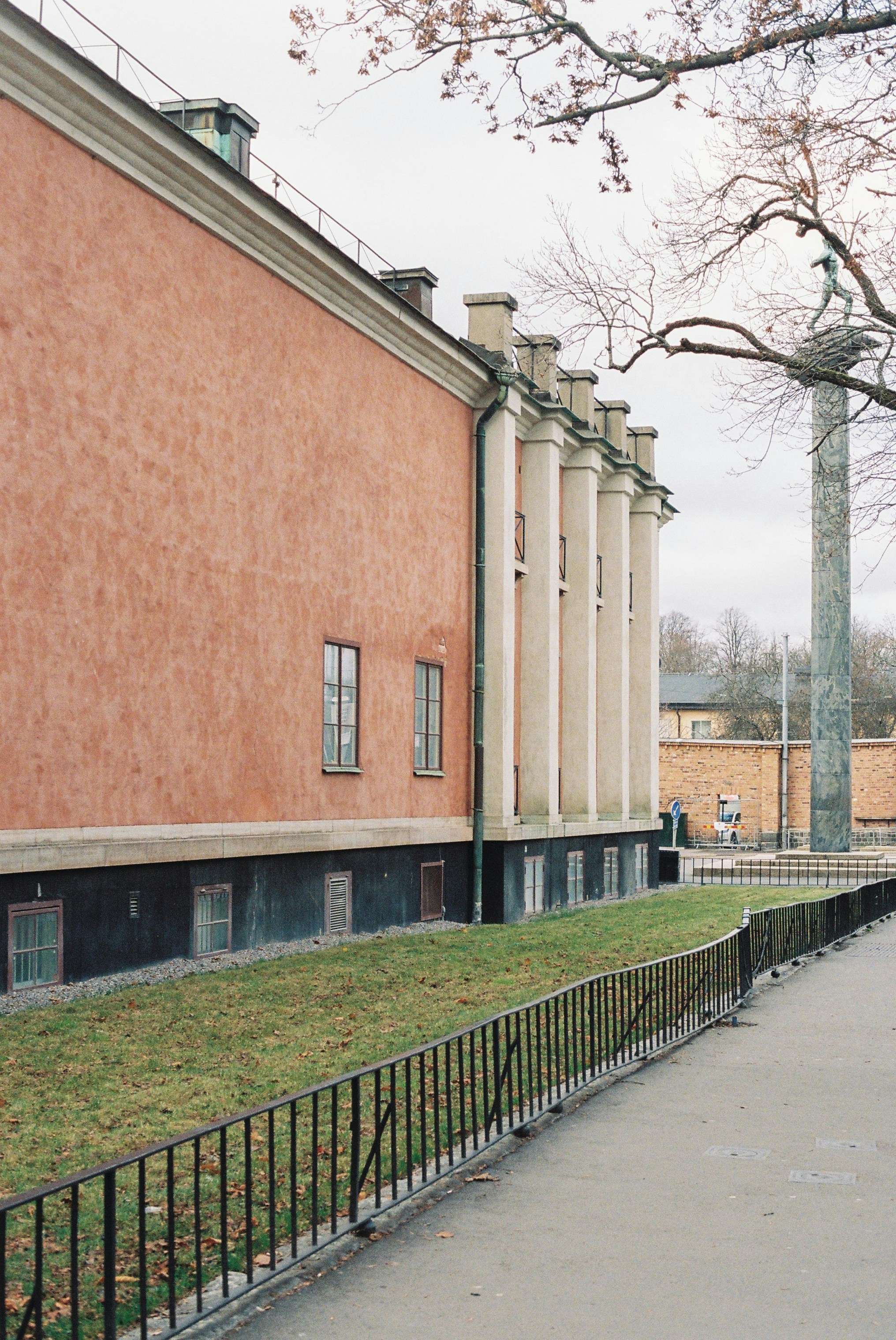 A brick building with a fence photo – Free Stockholm Image on Unsplash