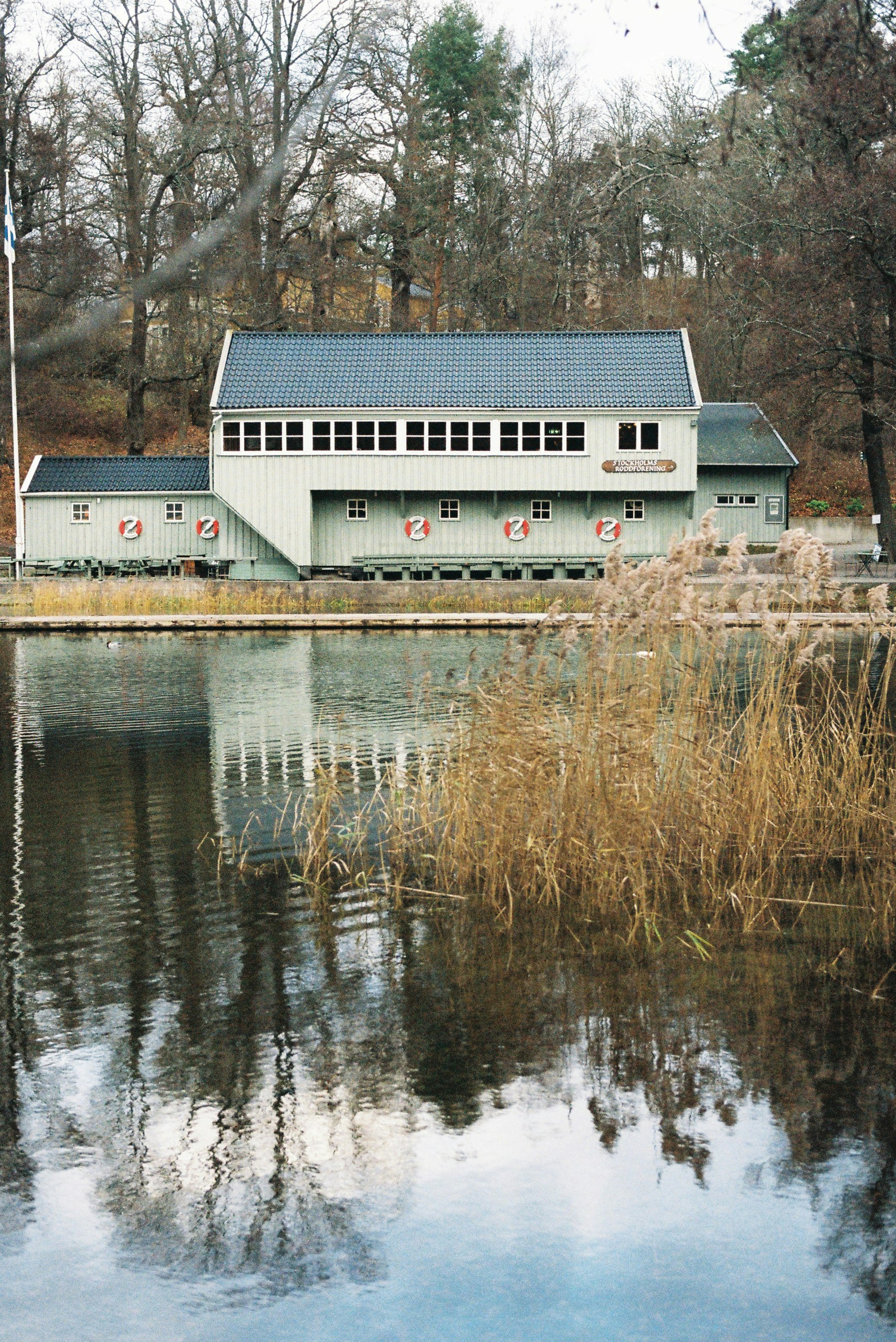 Boathouse on the Quiet Lake: Winter Reflections