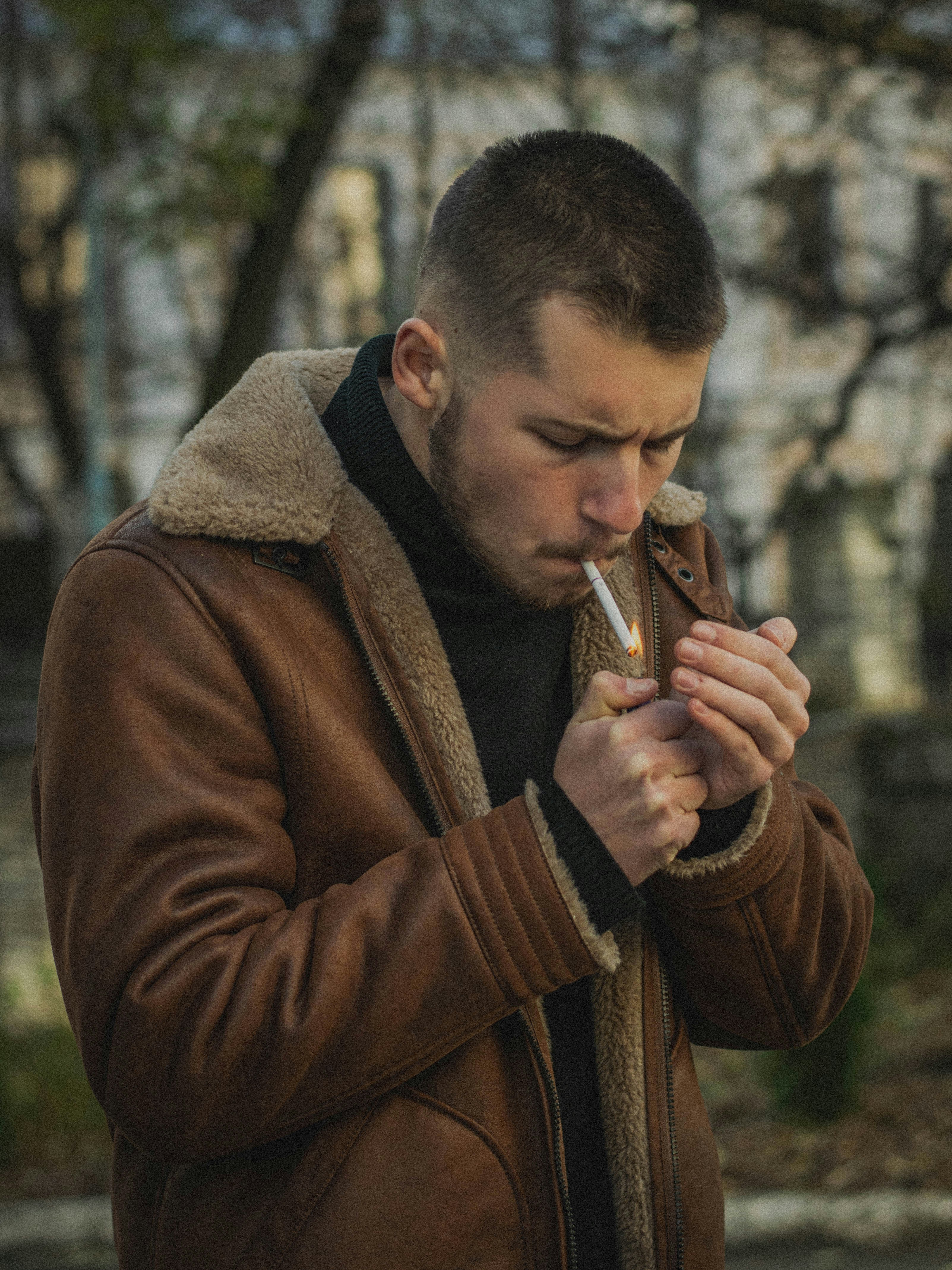 A man smoking a cigarette photo – Free Ukraine Image on Unsplash