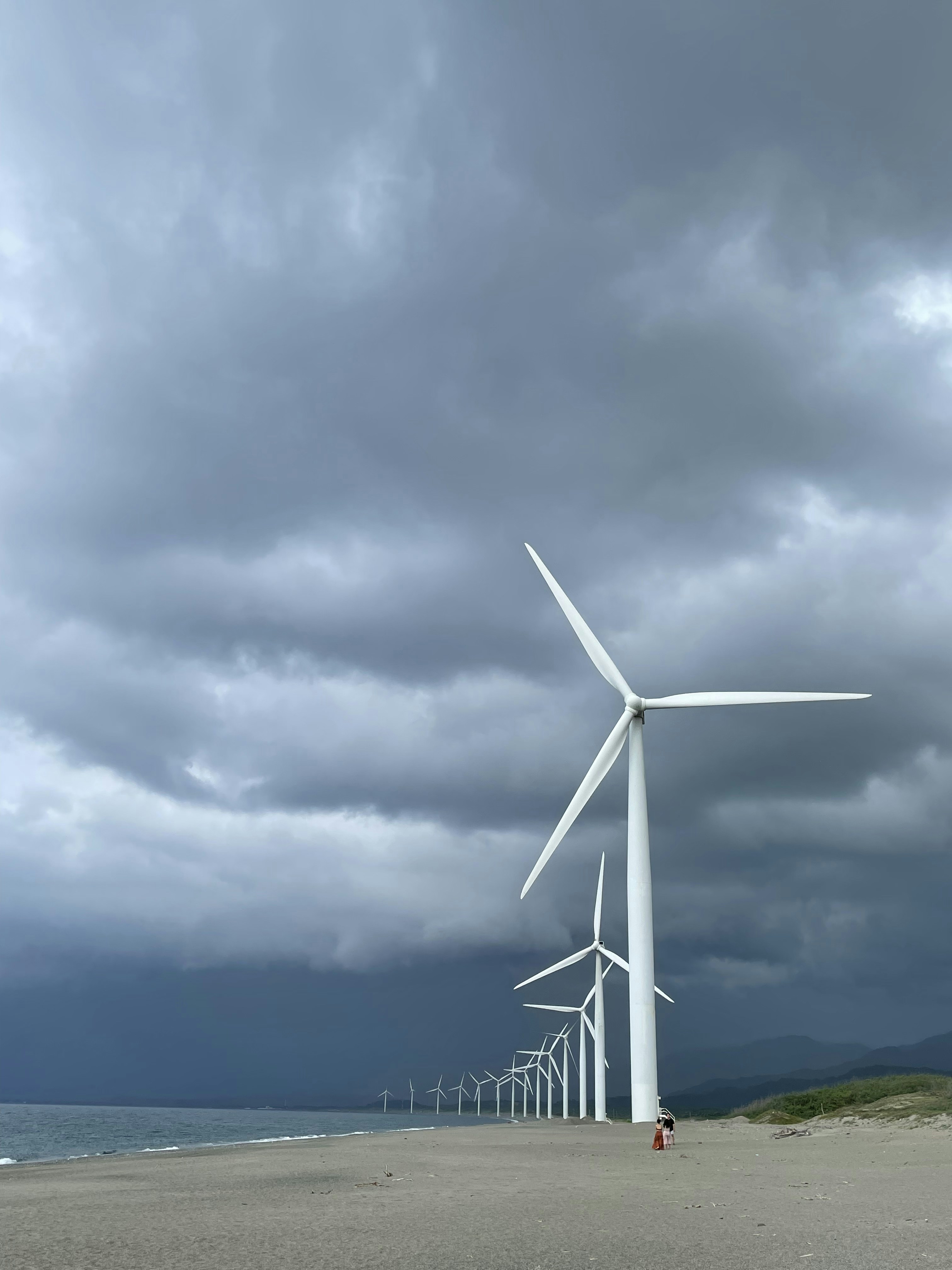 A group of wind turbines on a beach photo – Free Bangui Image on Unsplash