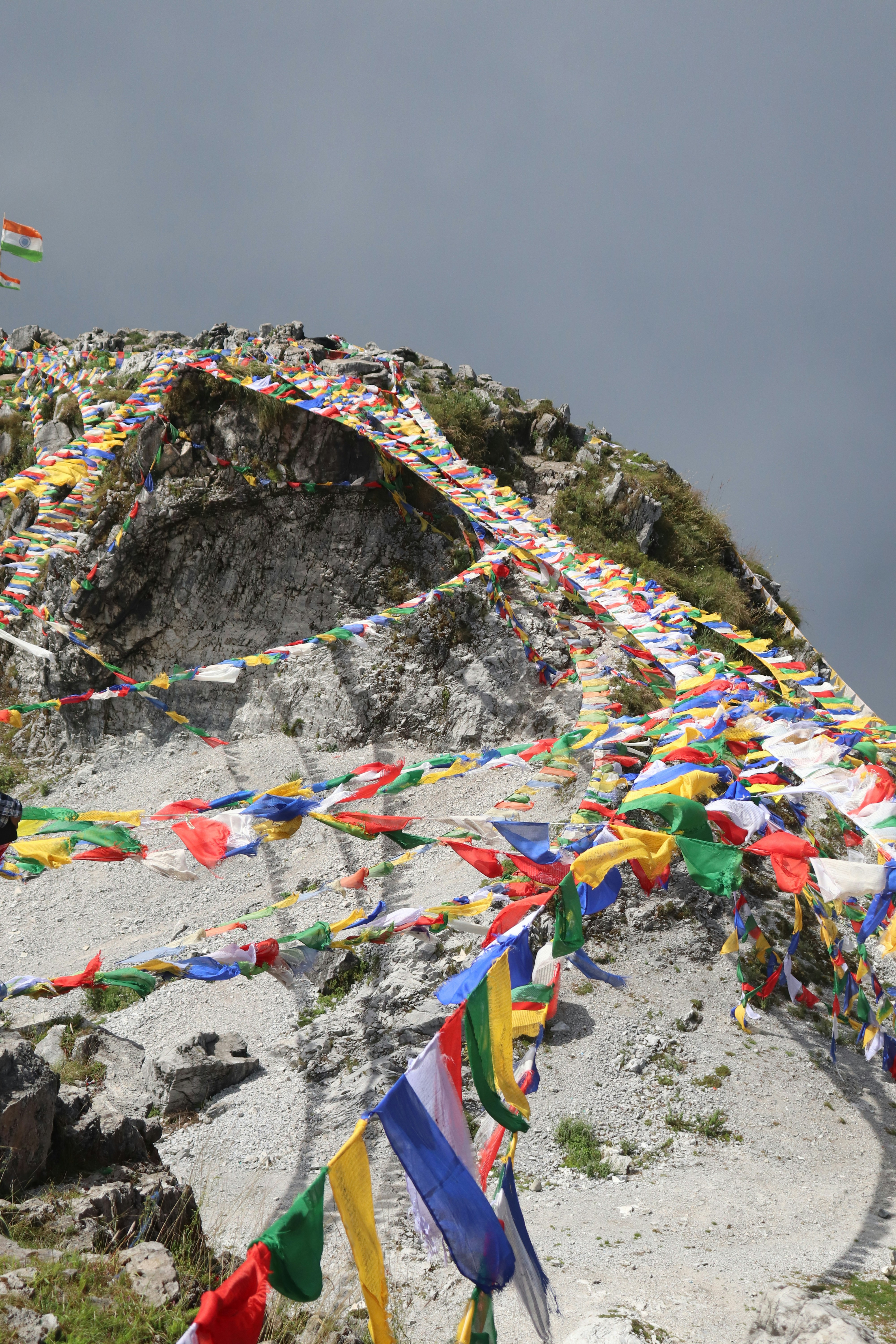Ribbons of Wind: Prayer Flags Stretch Across a Rugged Alpine Ridge