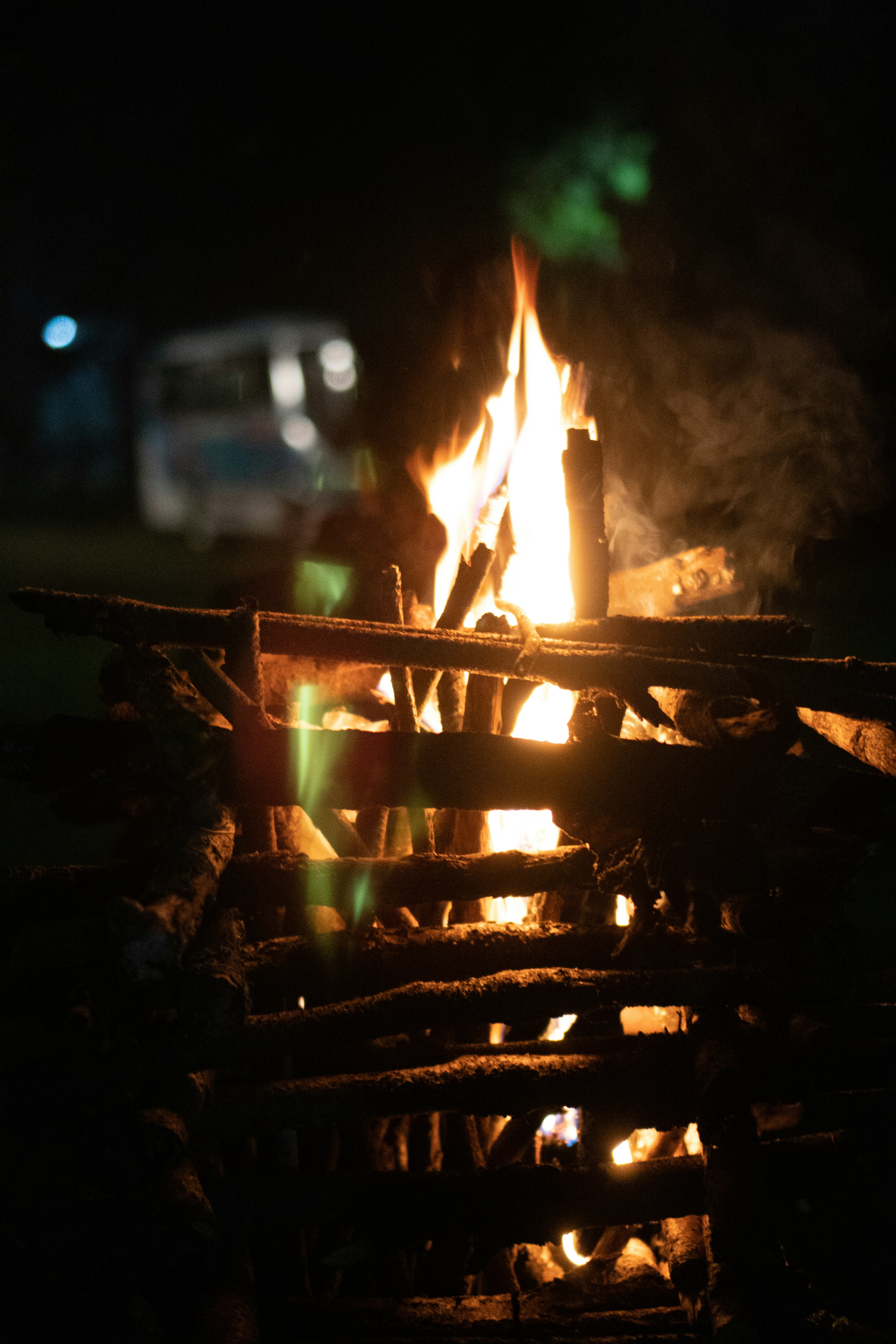 Candlelit Logs: A Night by the Campfire