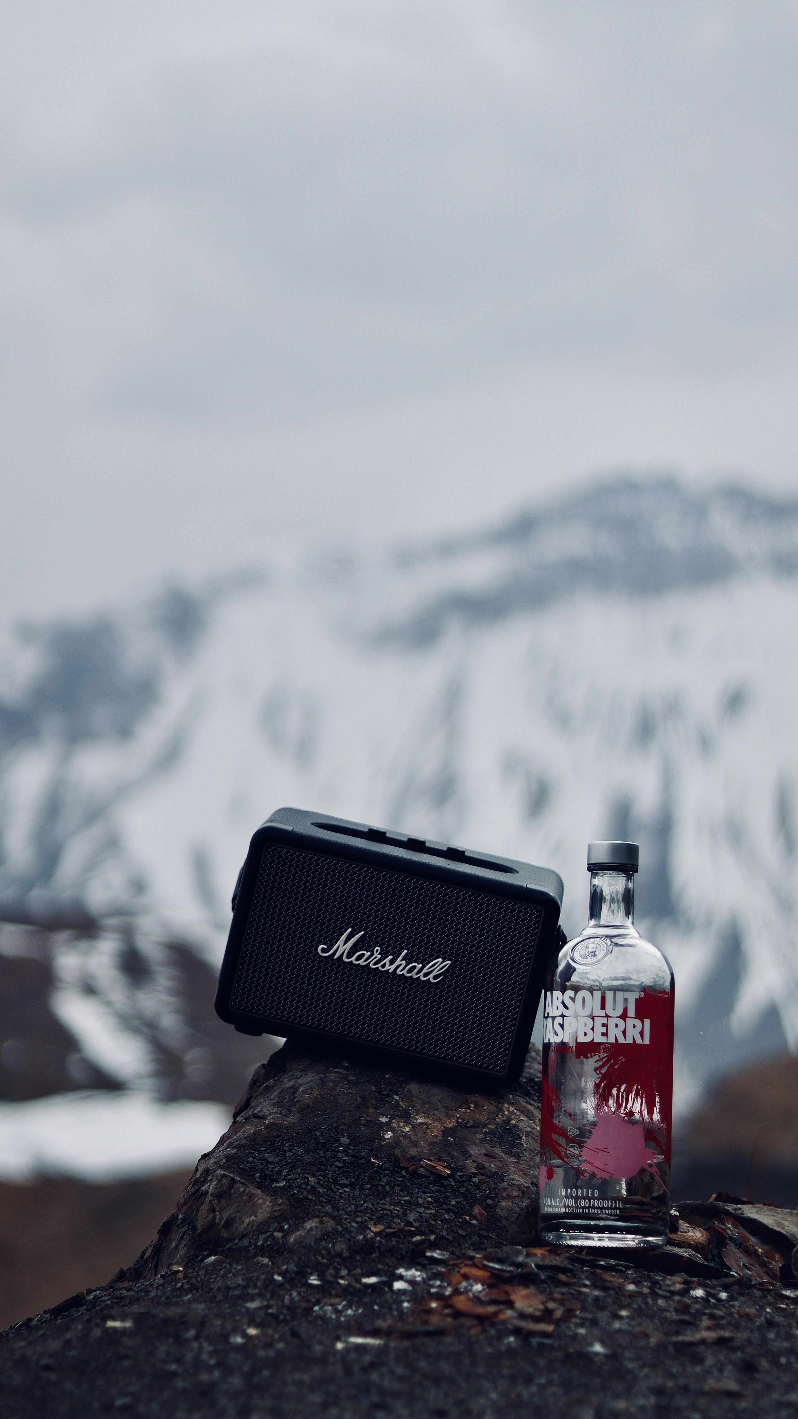A bottle of alcohol on a rock photo – Free Bottle Image on Unsplash