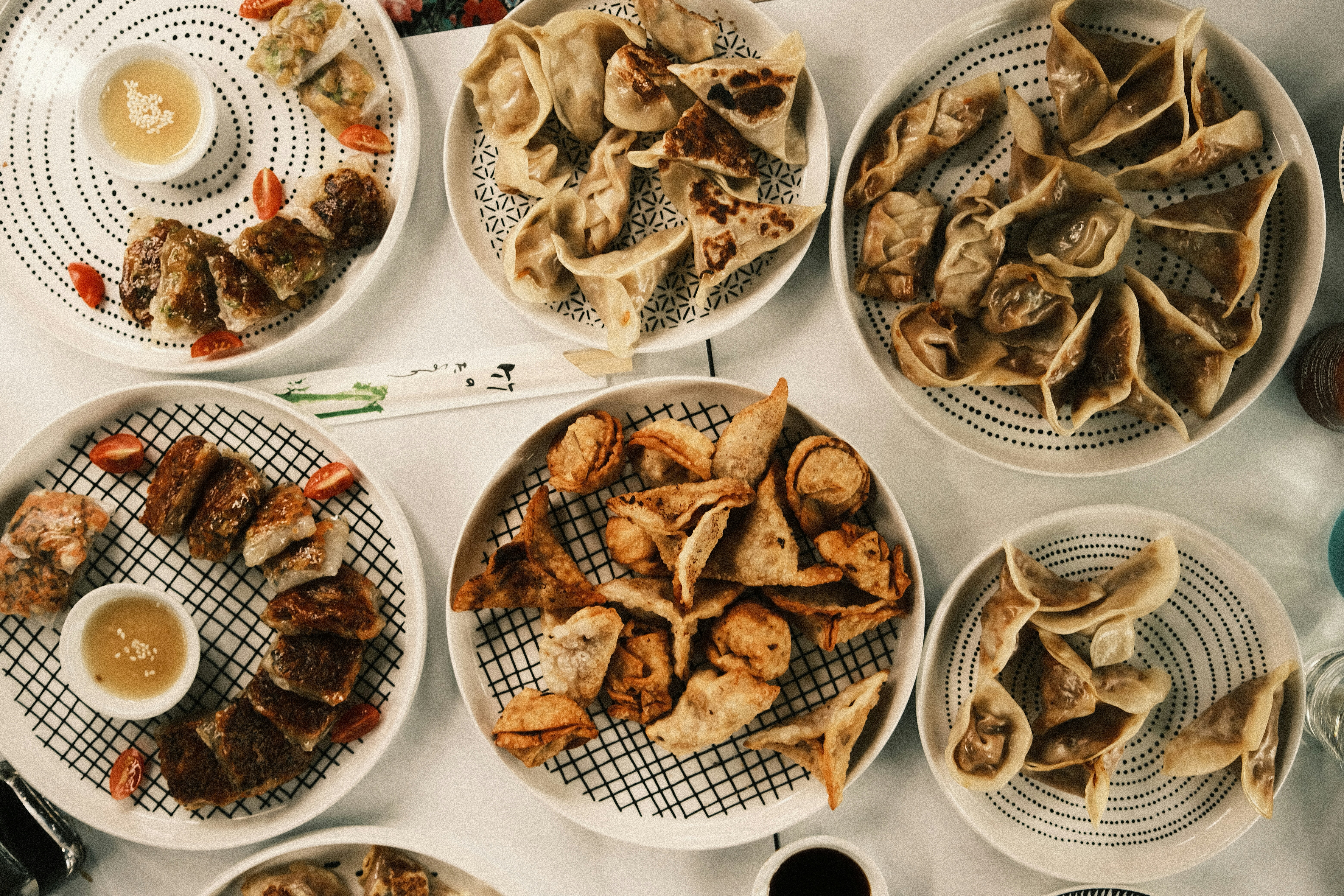 Dumpling Bounty: Golden Crisps on a White-Plate Spread