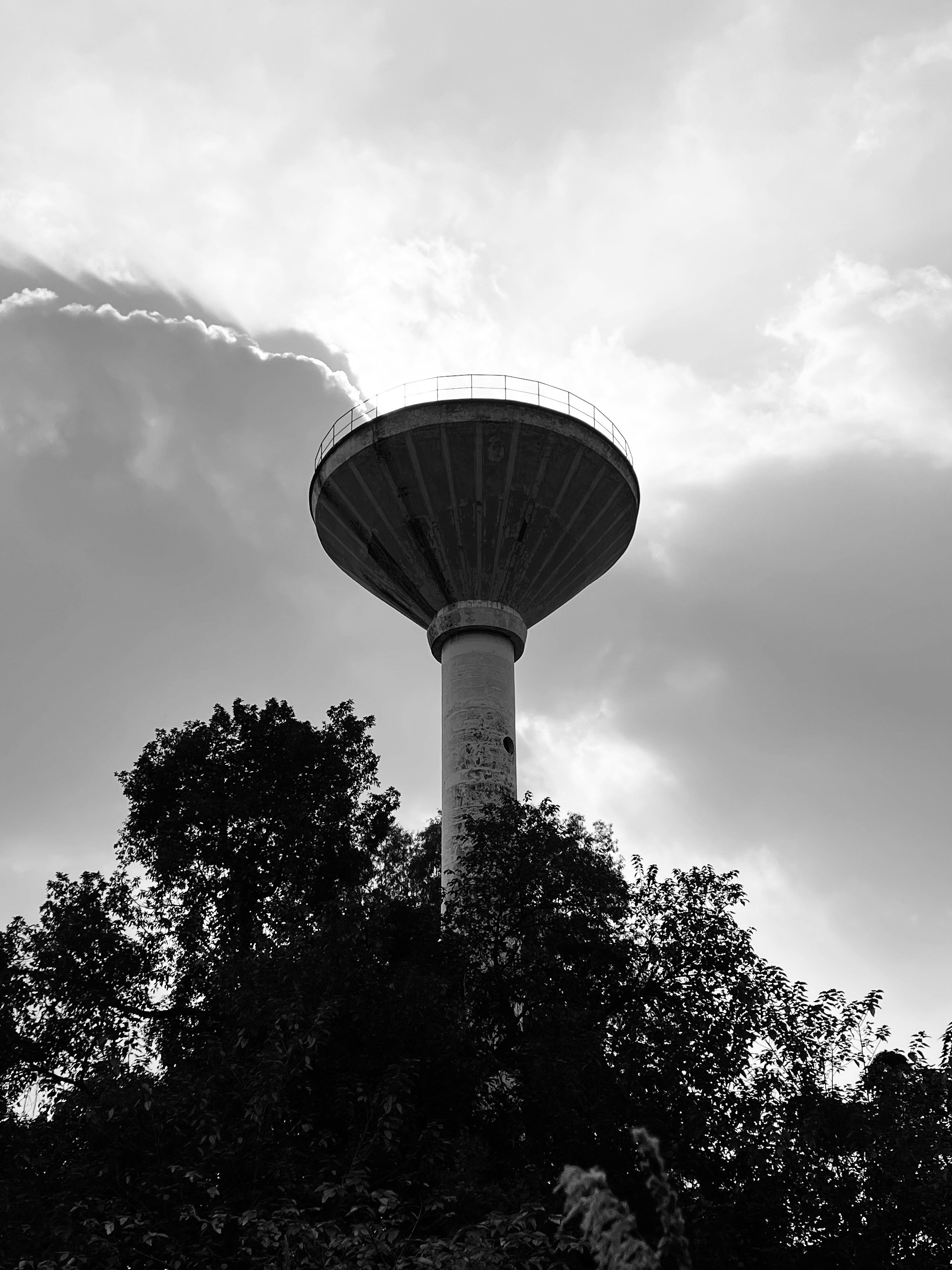 The Silent Sentinel: A Water Tower's Watchful Gaze