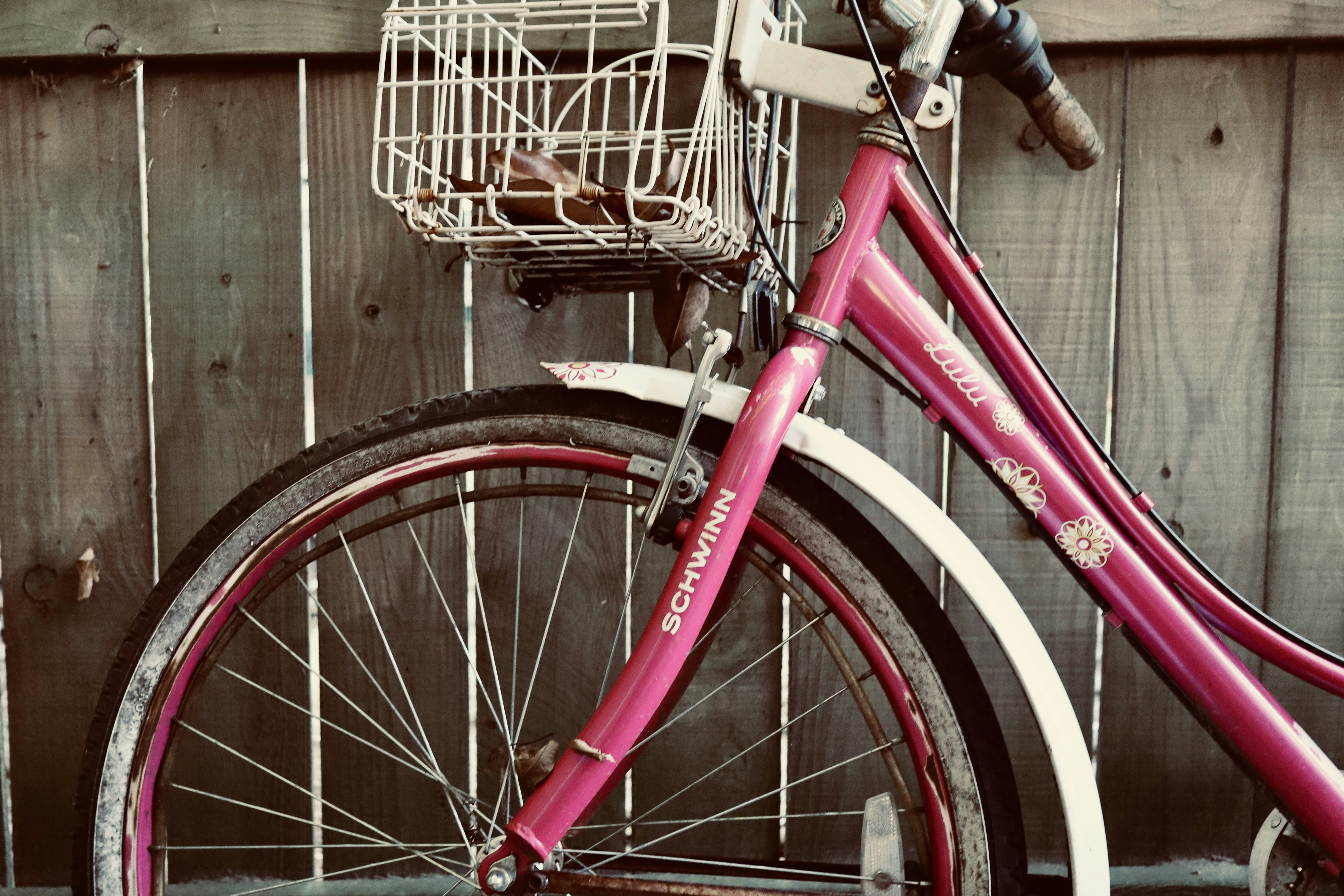 Vintage Bike Against Weathered Fence