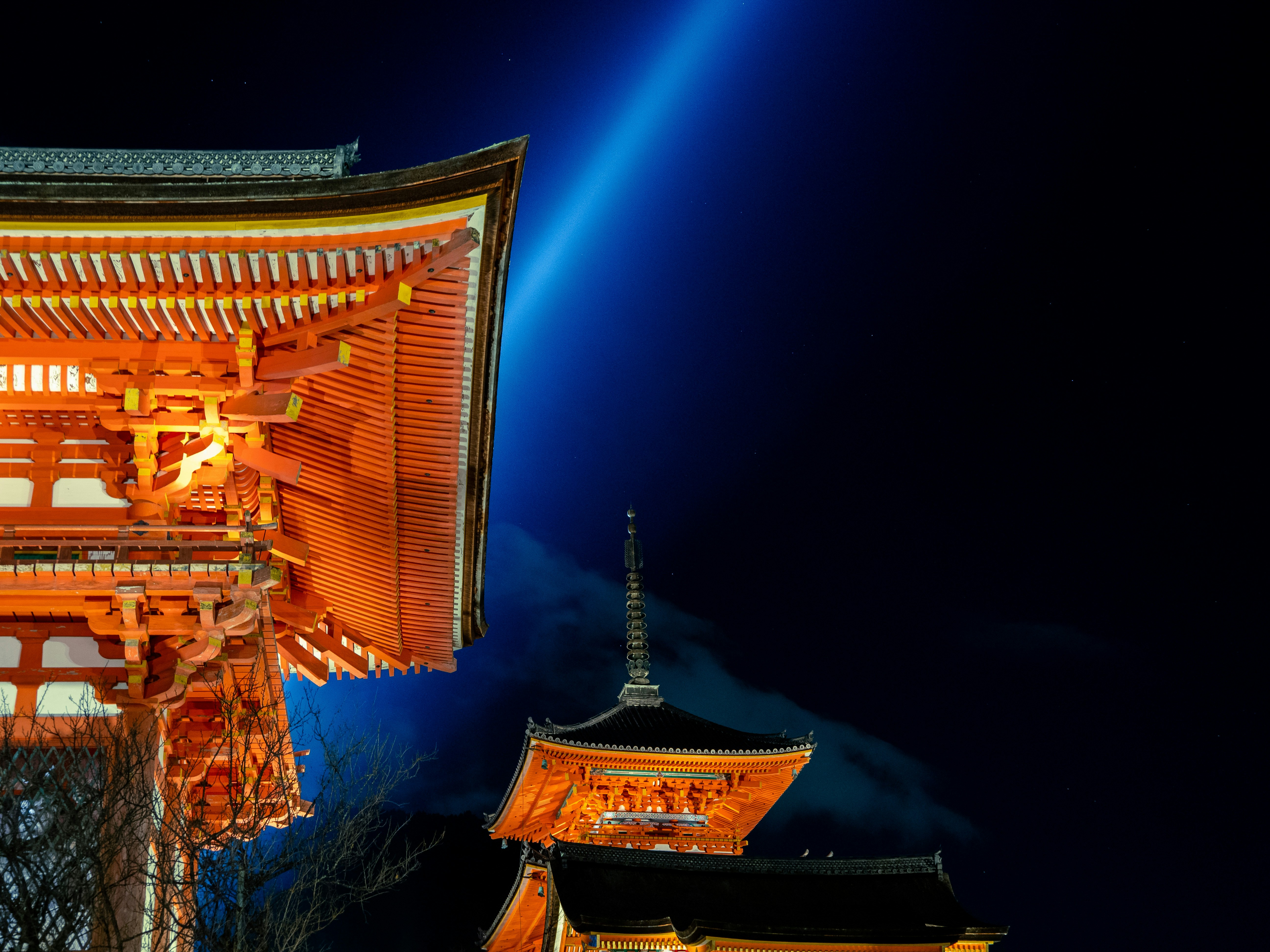 A building with a tower and a pointed roof at night photo – Free Japan ...