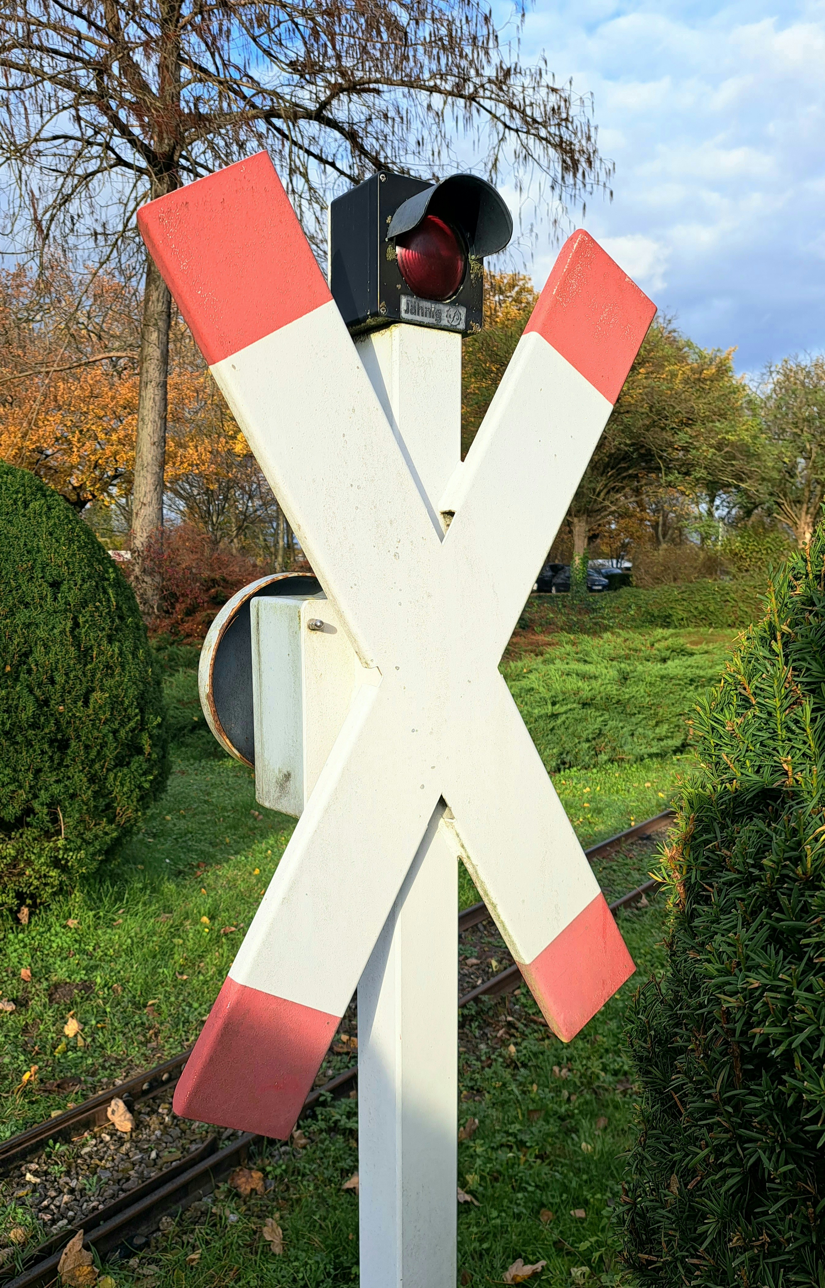 a sign on the side of a train track