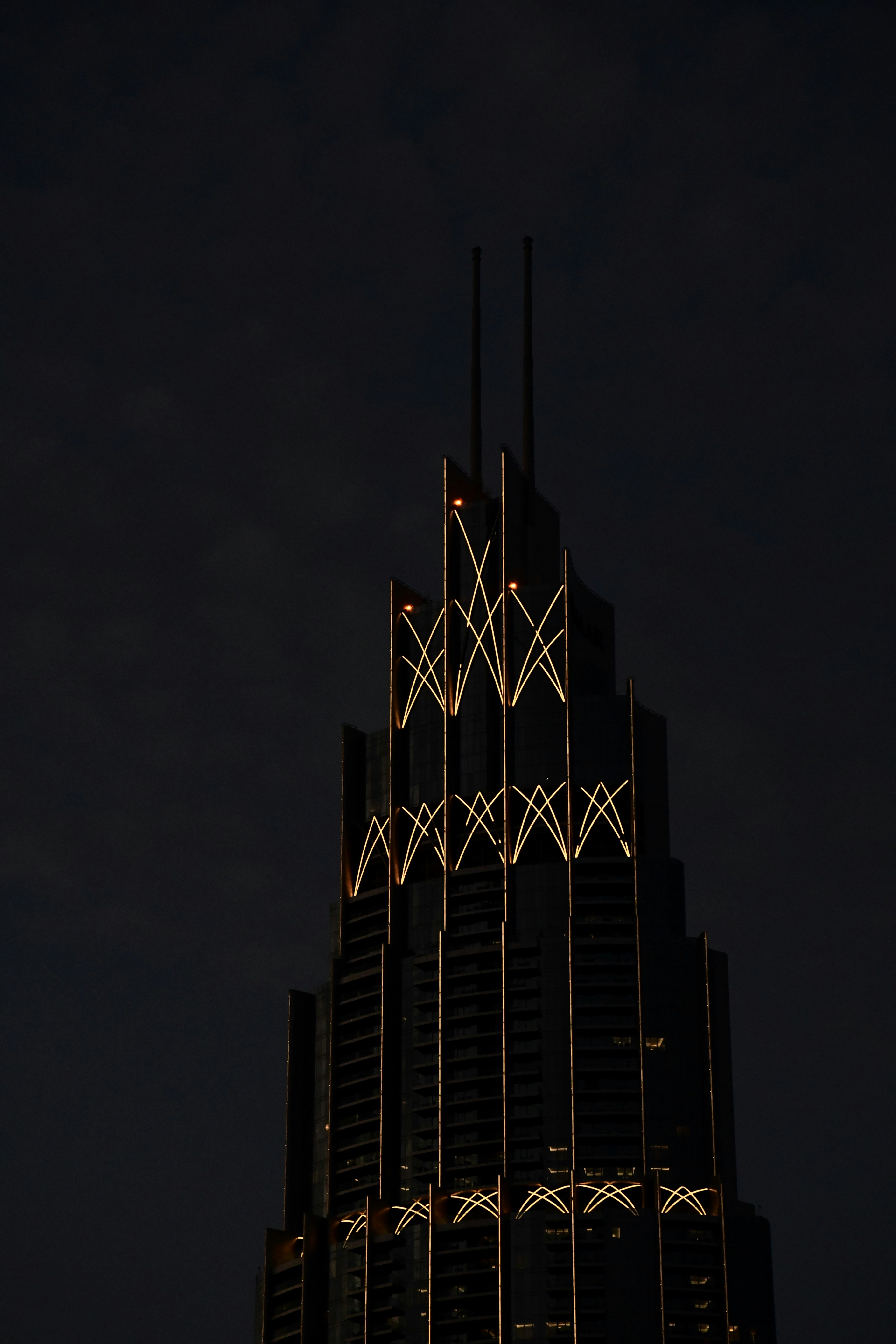 Neon Crown at Night: Geometry of Light on a Tower