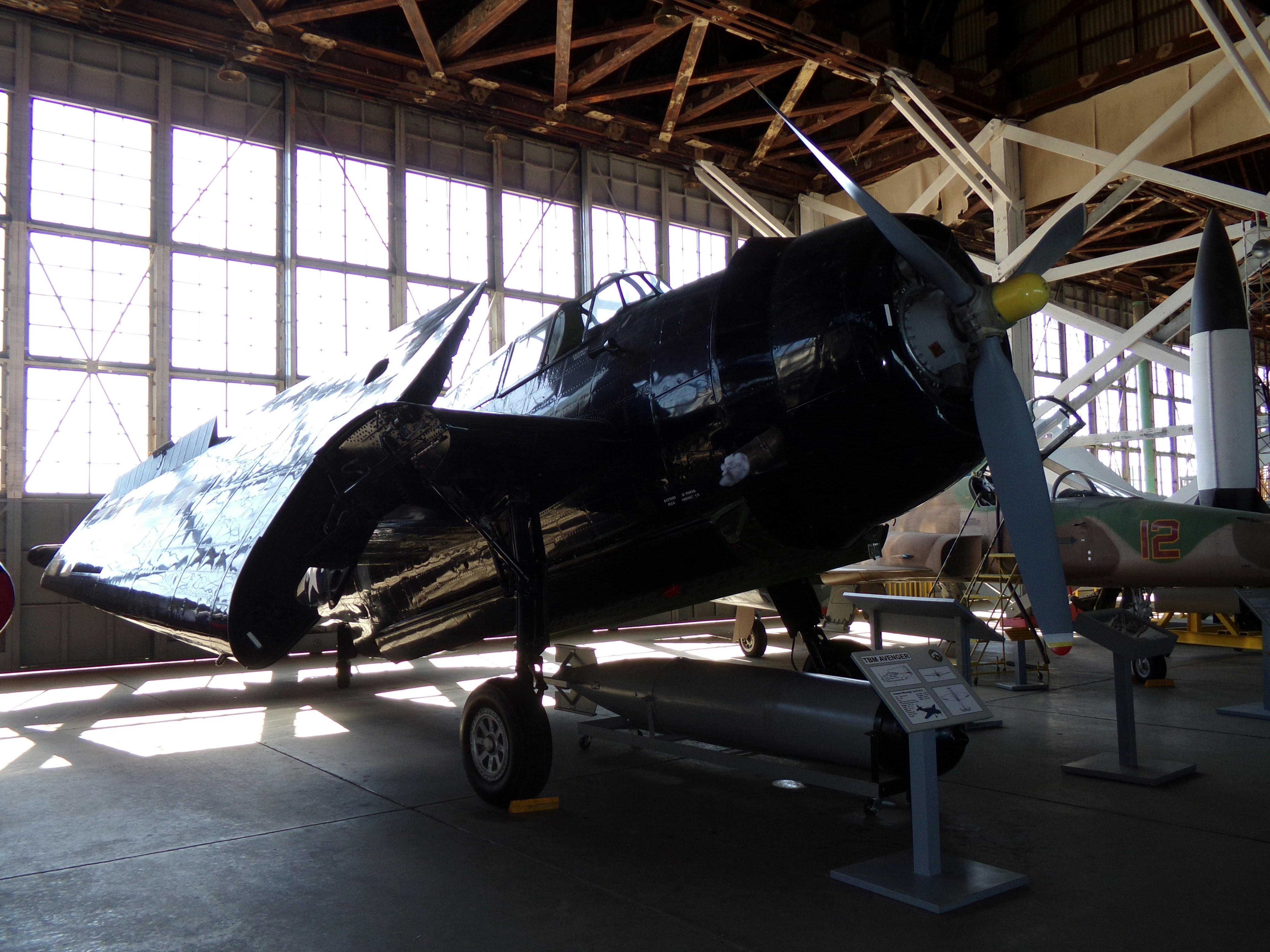 World War II aircraft displayed in an aviation museum, showcasing its sleek design and historical significance.