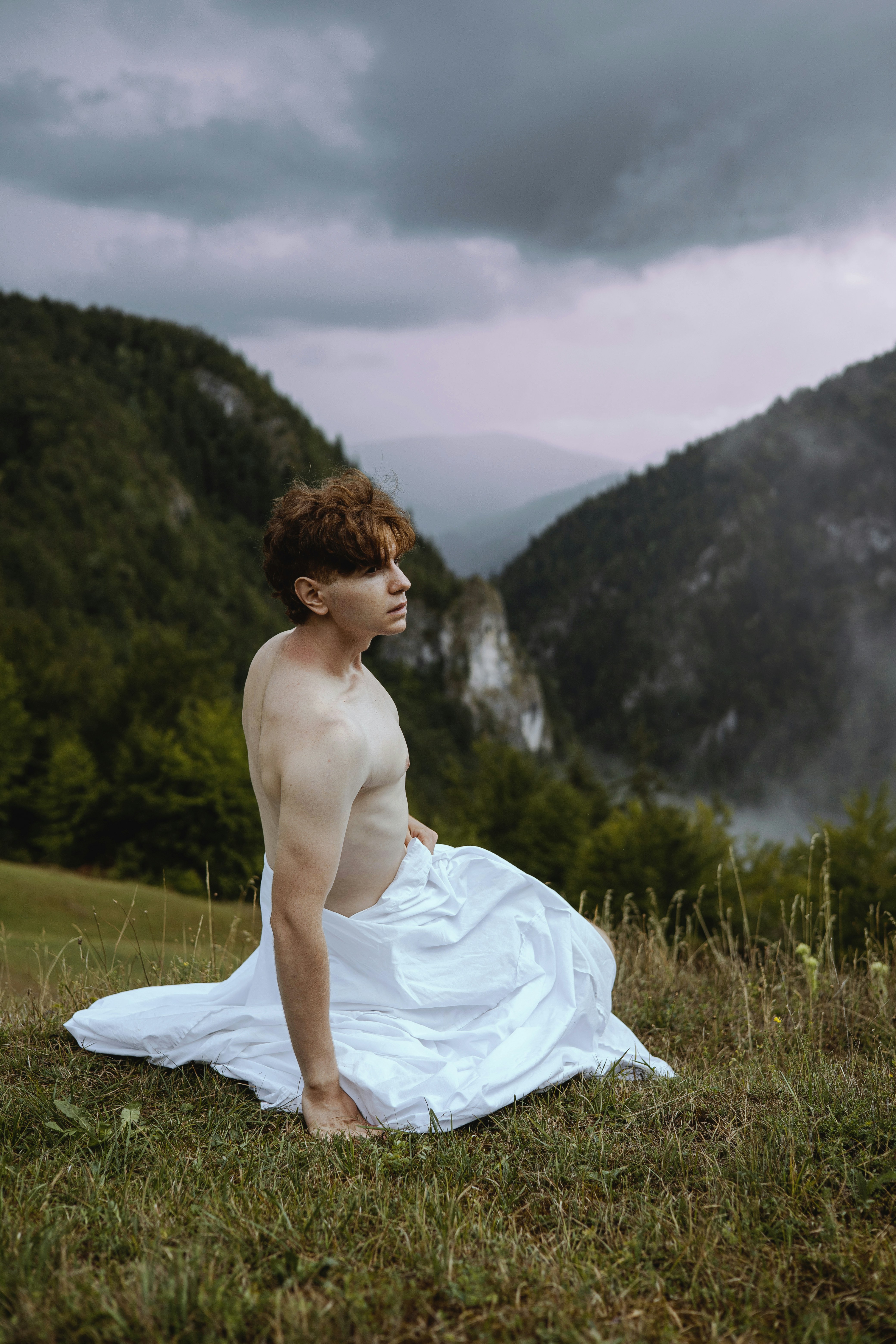A man sitting in a field photo – Free Fallen angel Image on Unsplash