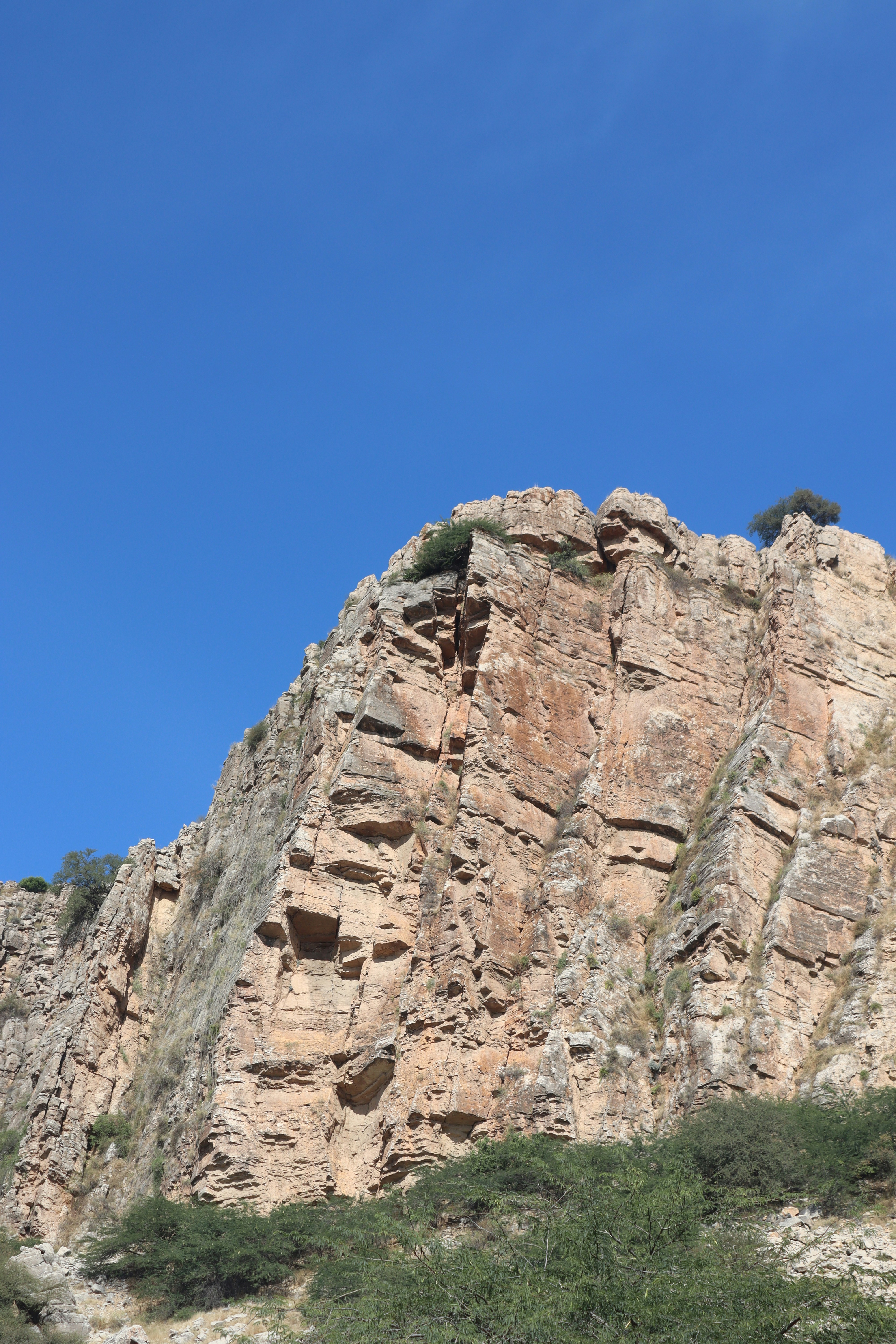A large rock cliff photo – Free Download wallpaper Image on Unsplash