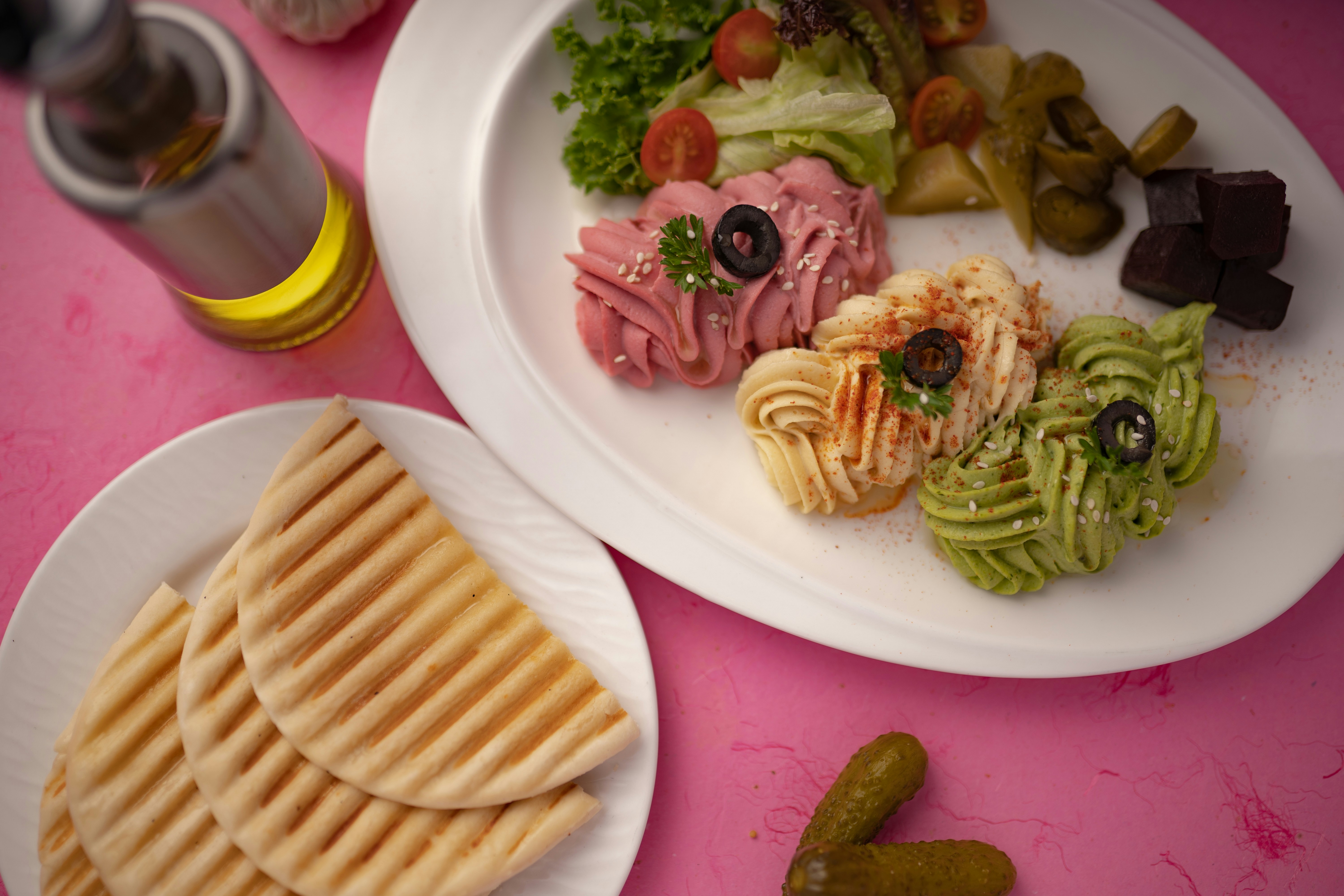 Colorful antipasto tangle on a pink backdrop